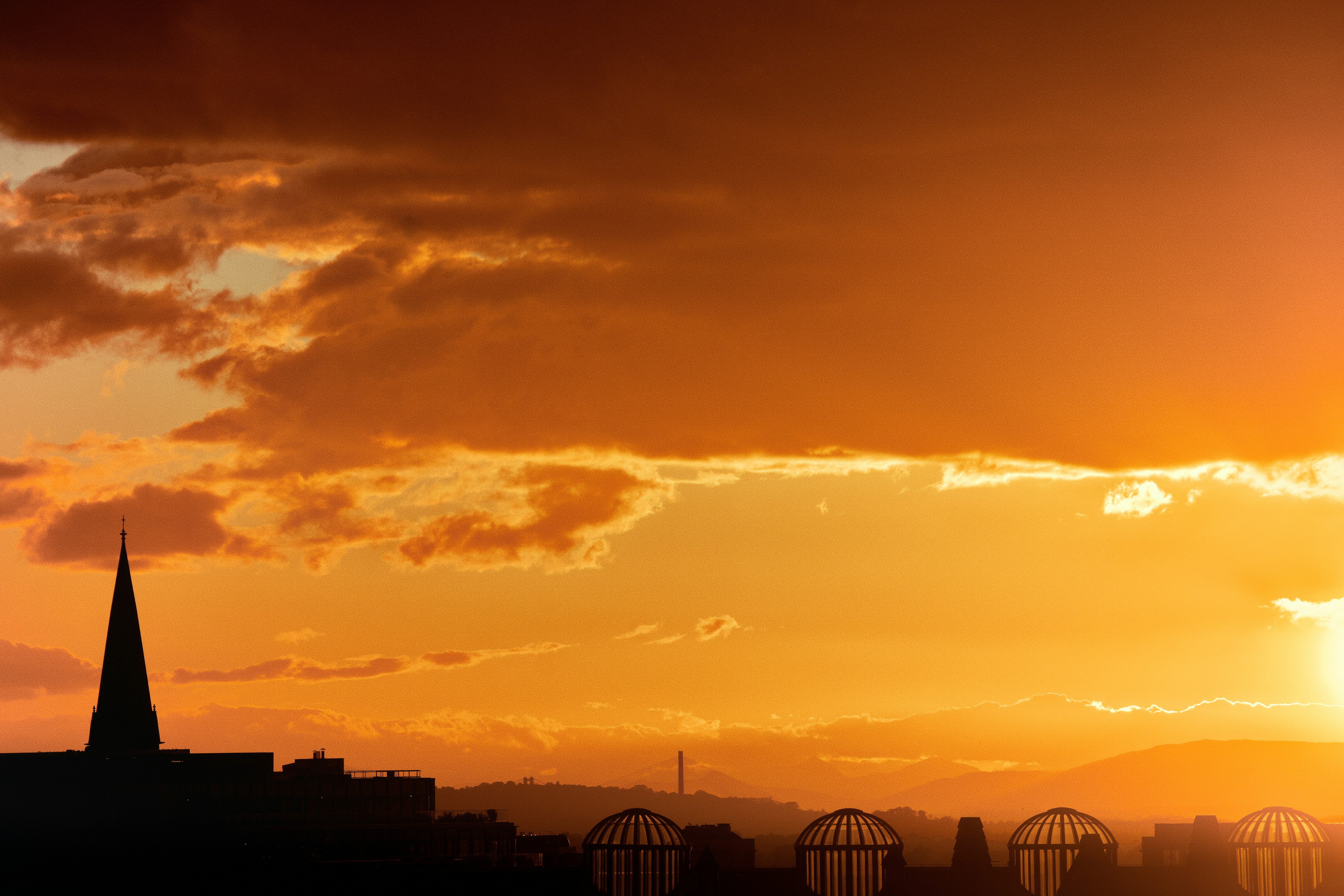 Horizon Blaze: City Silhouette at Golden Hour