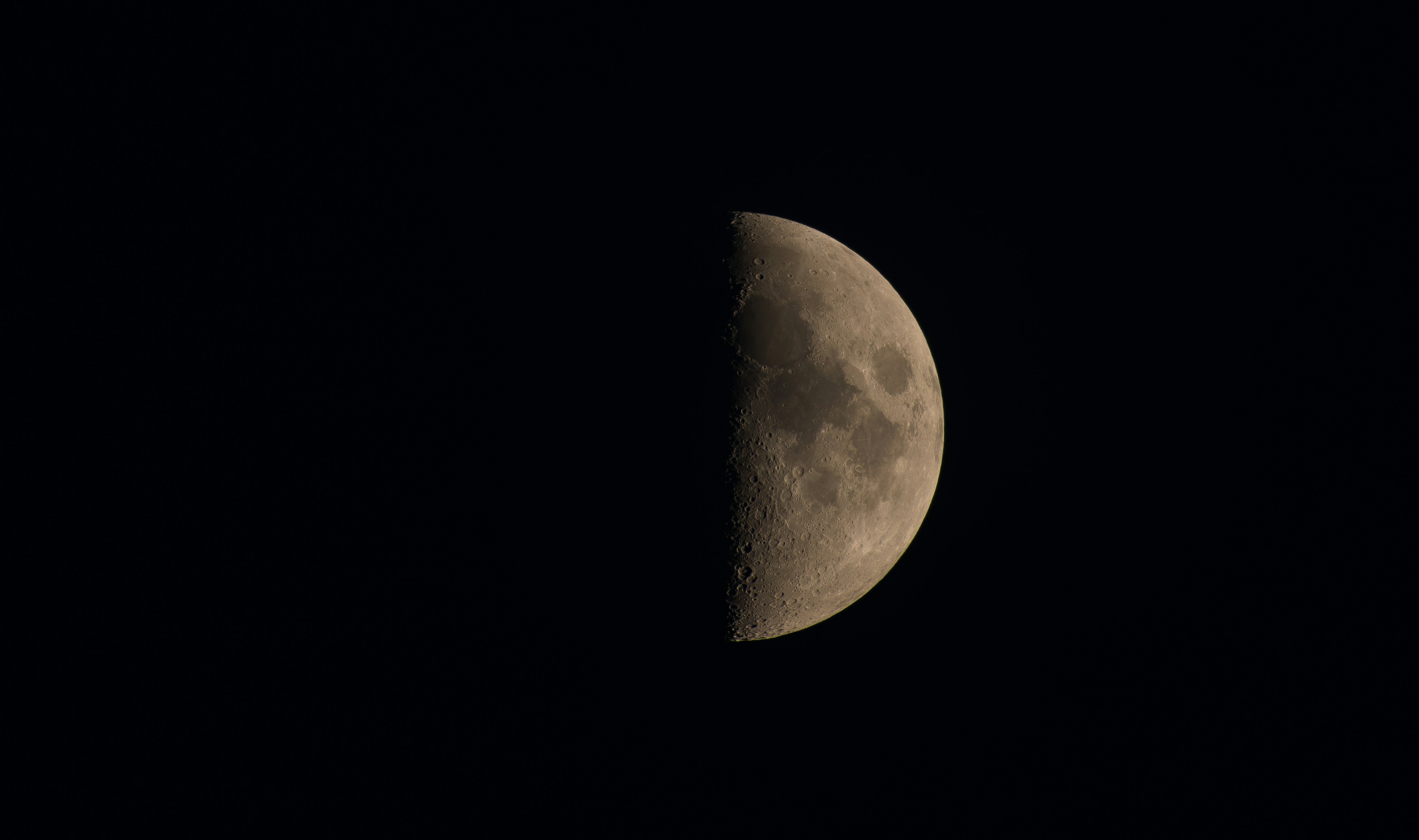 Luminous Crescent: Moonlit Silence Through a Narrow Gap