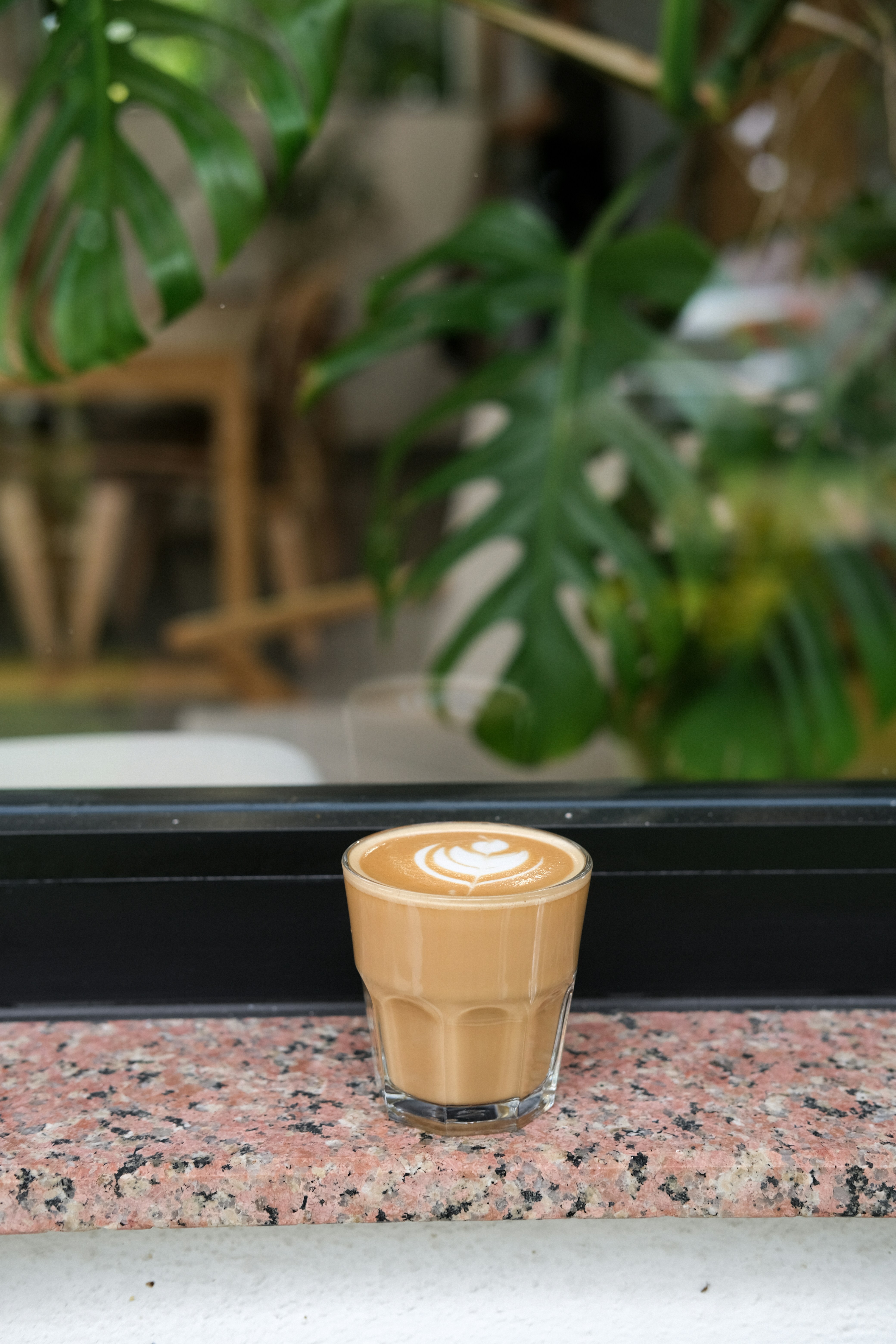Latte on Granite: Center Stage of a Quiet Café Window