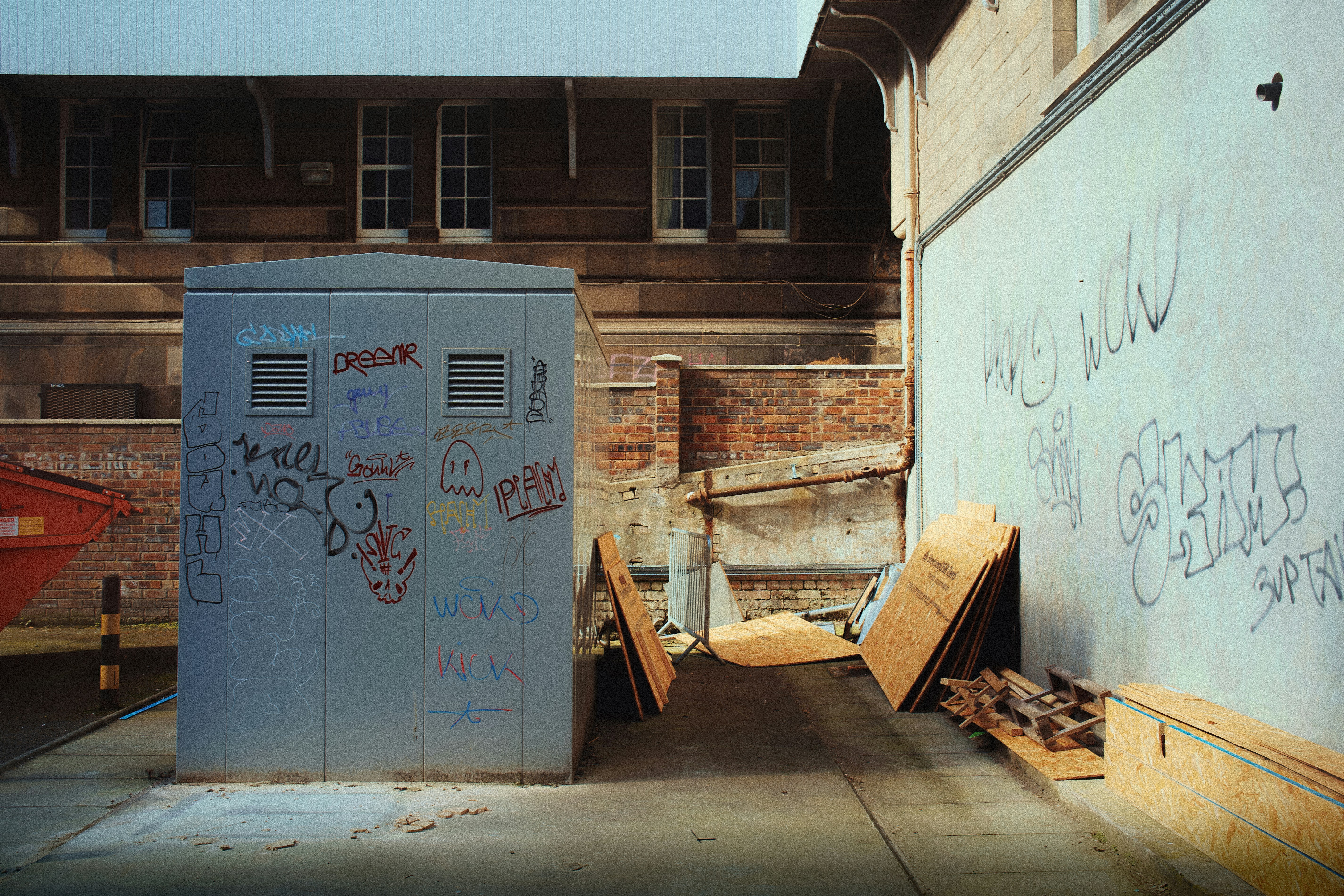 Graffiti Shelter: A Quiet Alley with a Graffitied Utility Box