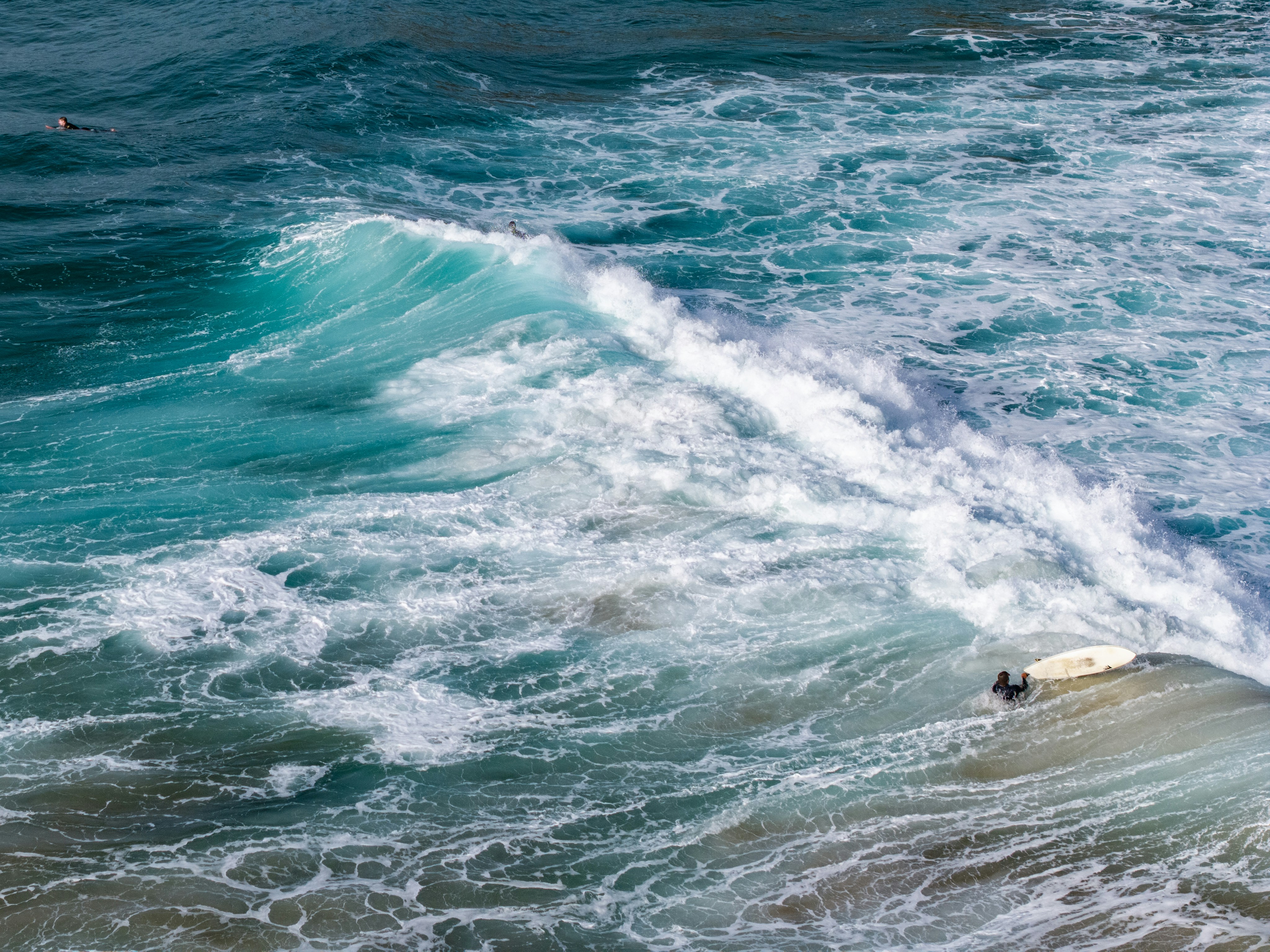 Iridescent Crest: A Wave Break Over the Reef