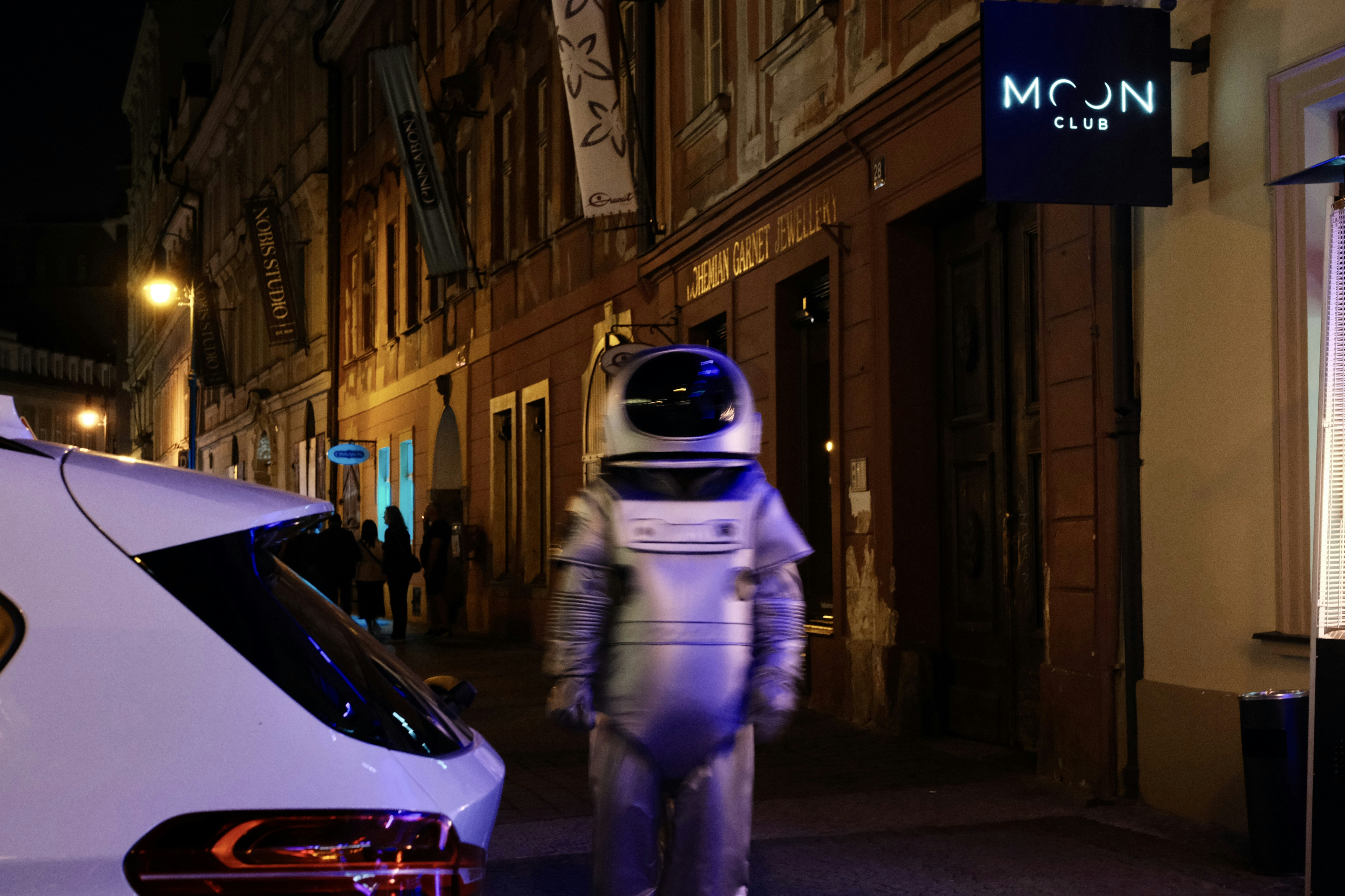 Urban Night Parade: Astronaut Among the Alleyway Neon