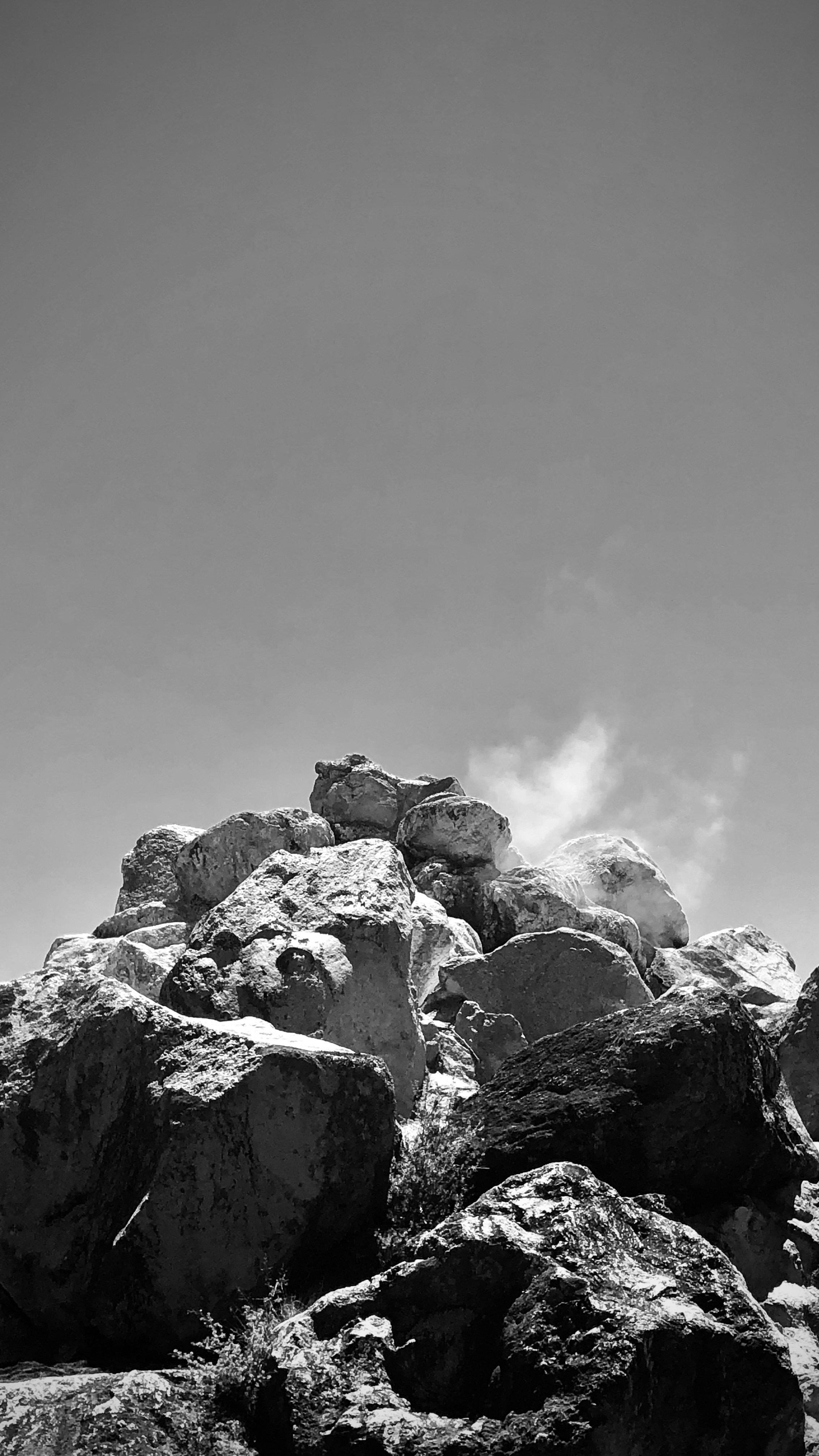  summit of weathered boulders beneath a clear sky