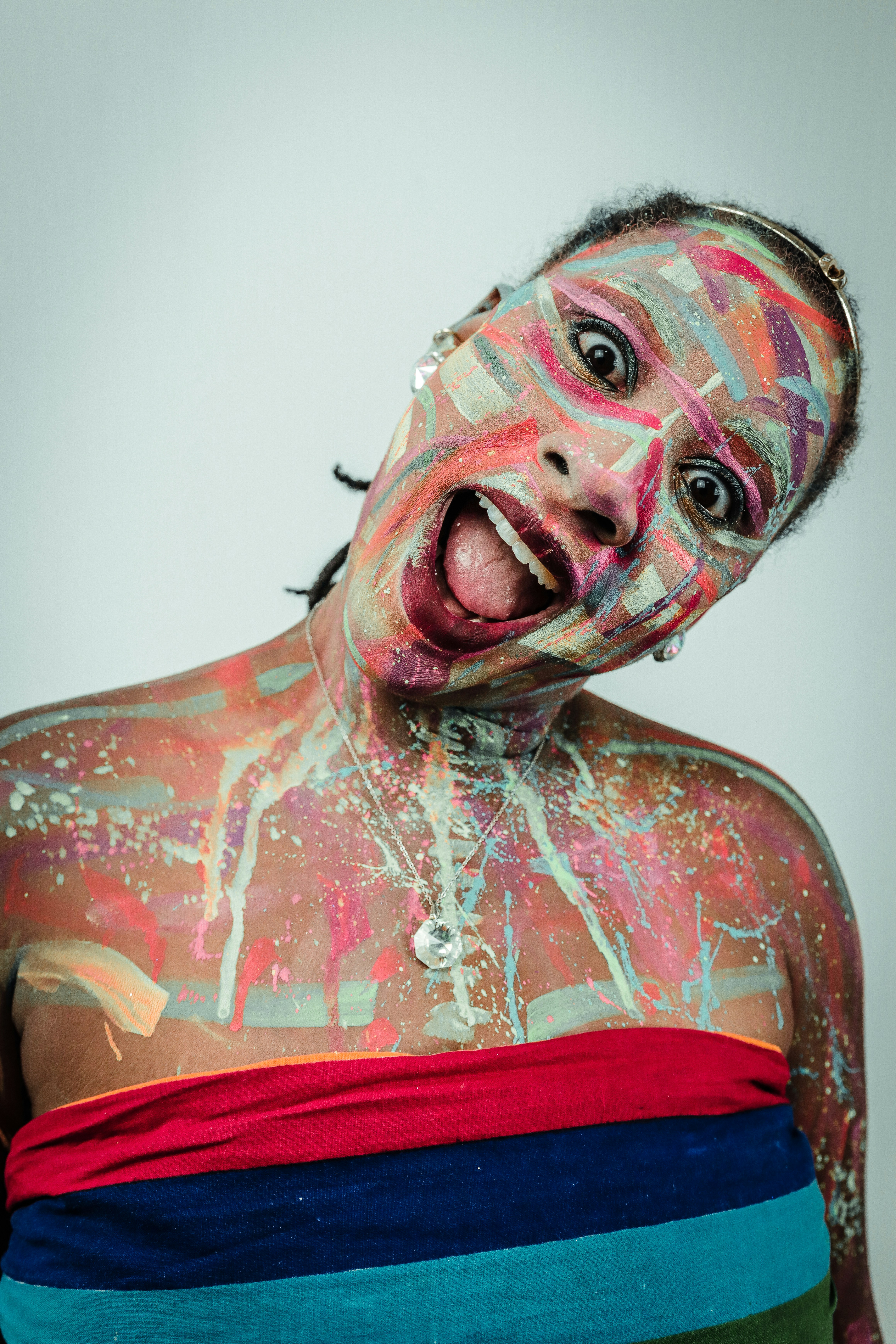 Portrait of Joy: Neon Paint and Expressive Gaze