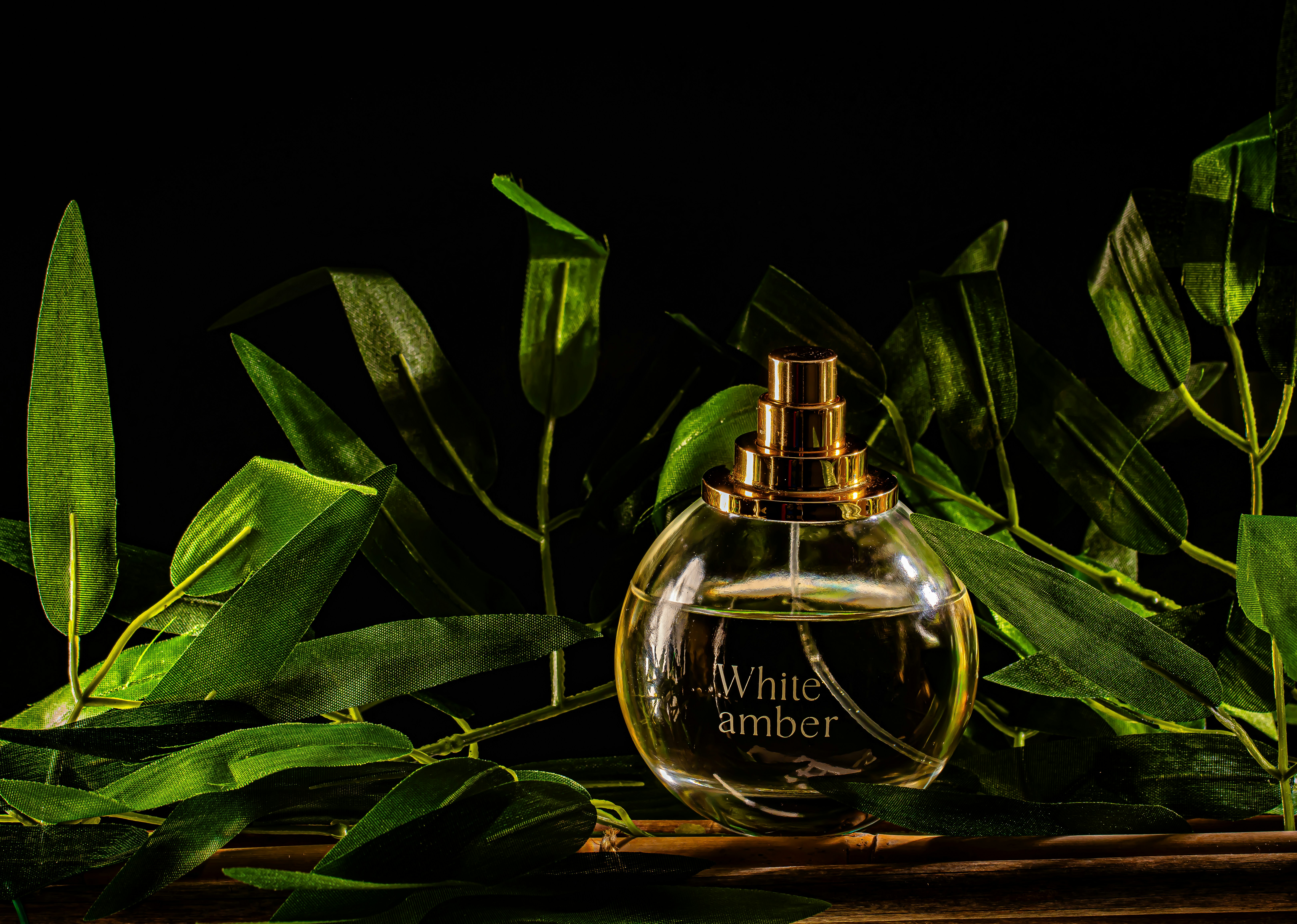 Amber Glow: A Bottle Among Greenery