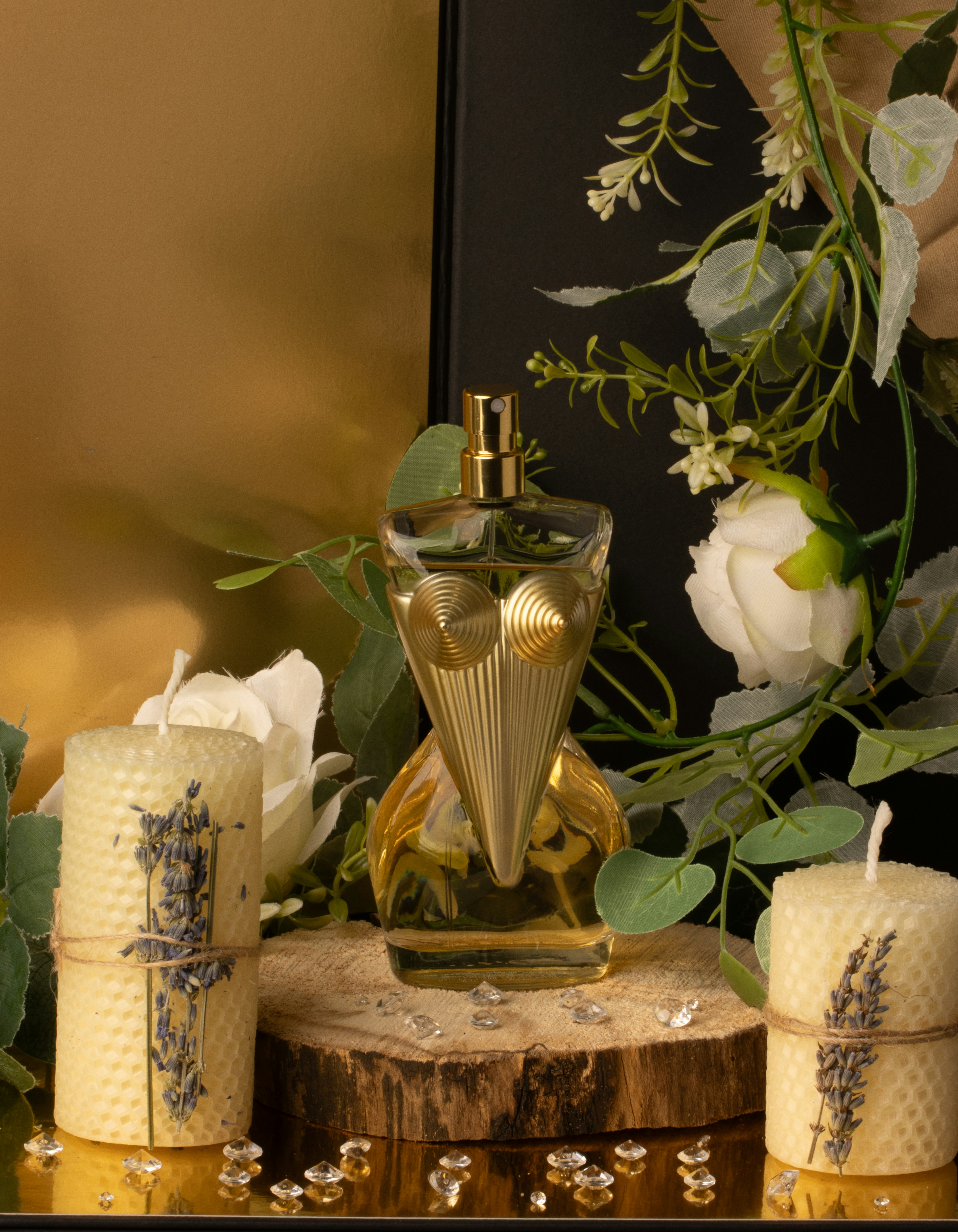 Gilded Essence: Ornate Perfume Bottle Centered Among Florals