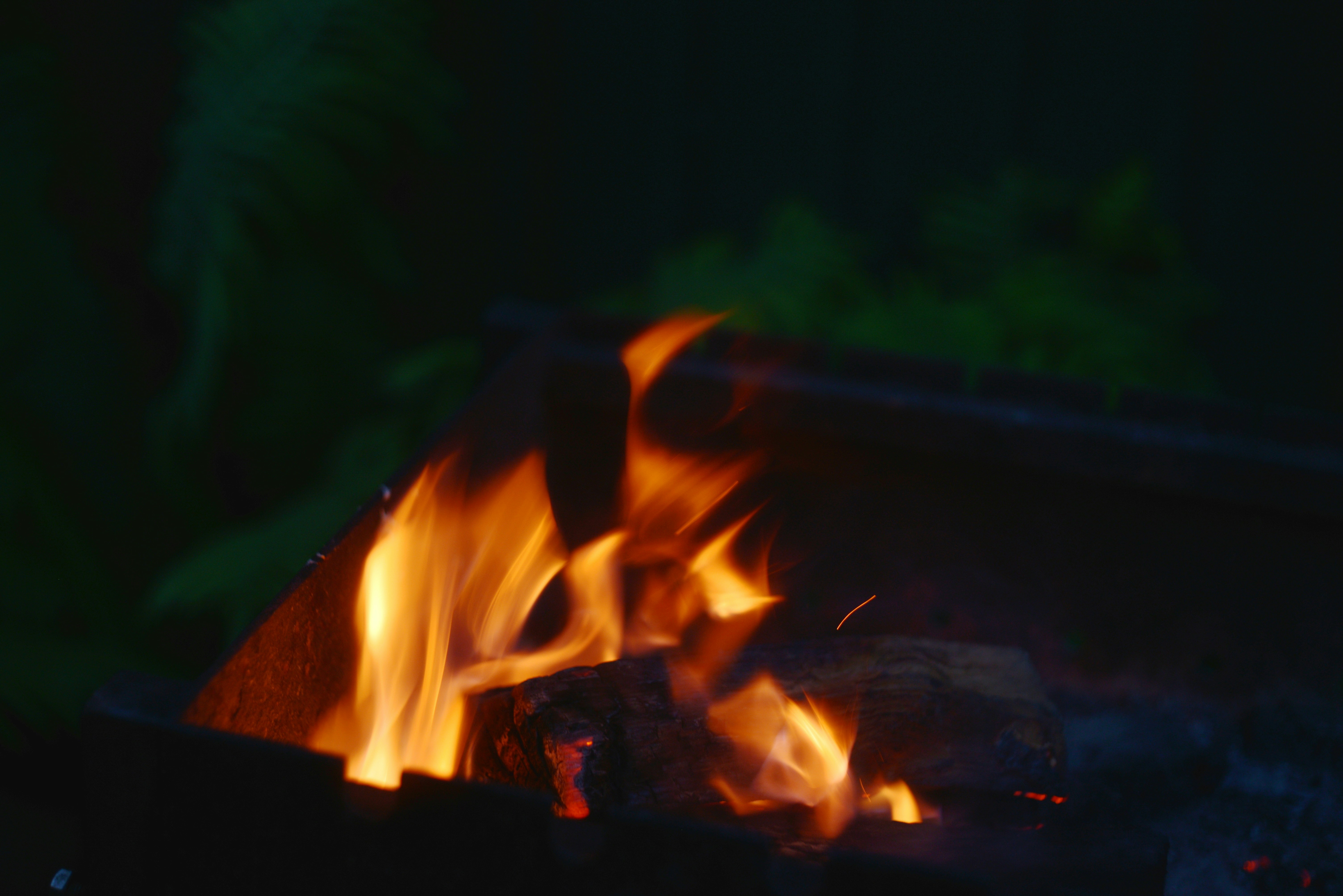 Embers and Shadow: Fire Pit Glow at Dusk