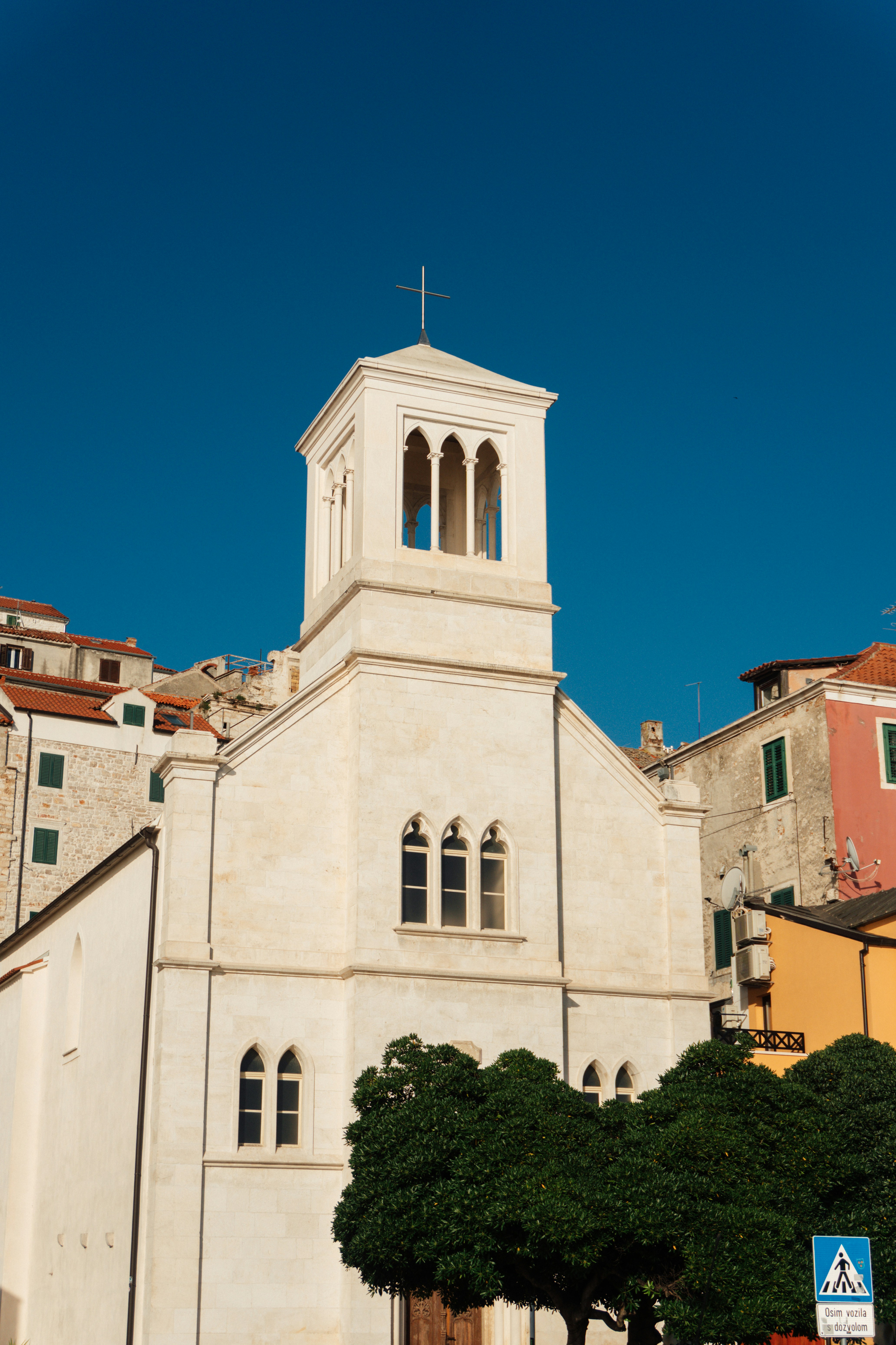 Bell Tower Rising Over Corsican townhouse rooftops