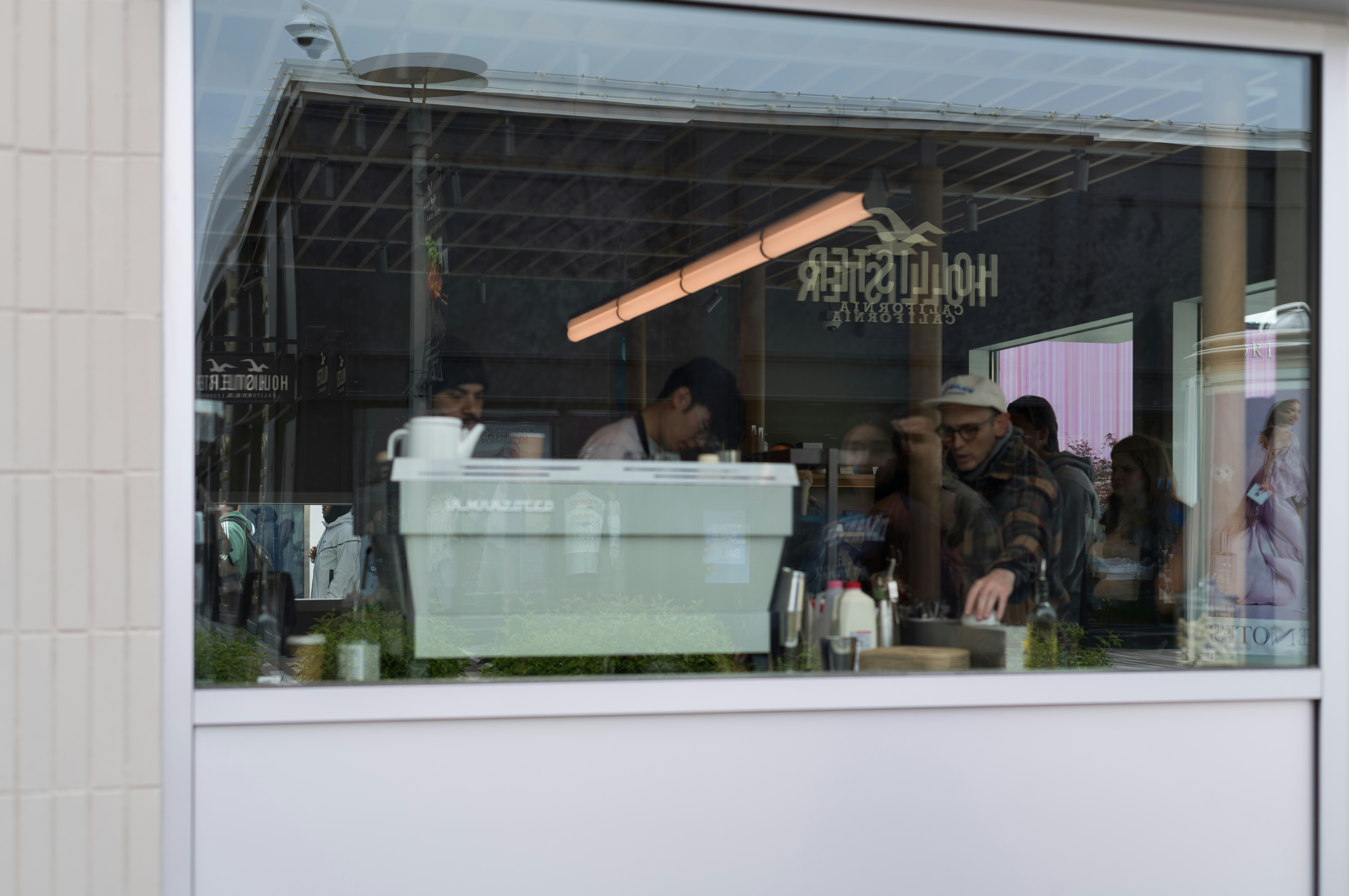 Inside the Glass: Baristas at Work Through the Café Window