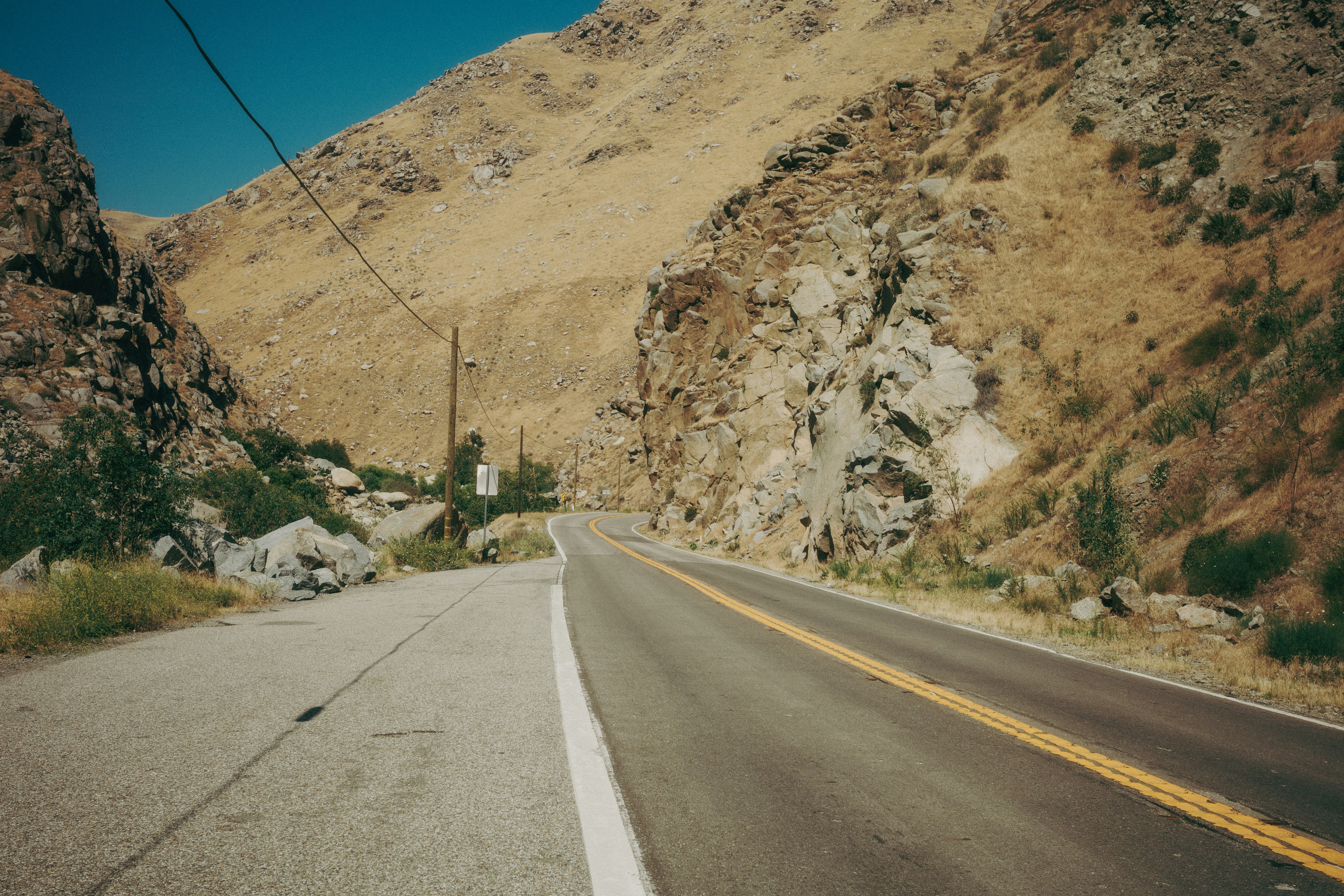 Winding road through arid mountain landscape. photo – Free Travel Image ...