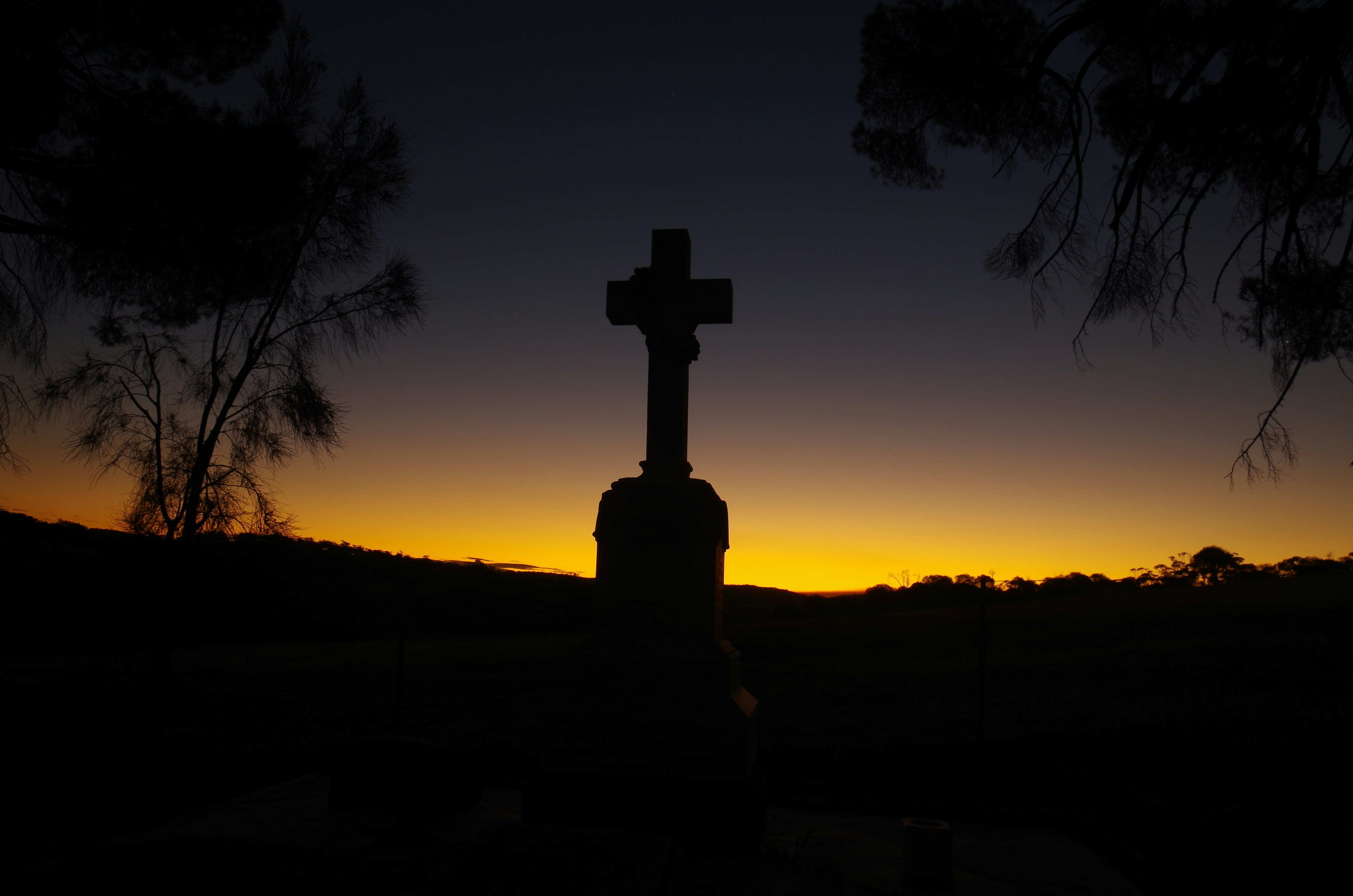 Sunset Silhouette: A Cross at Dusk