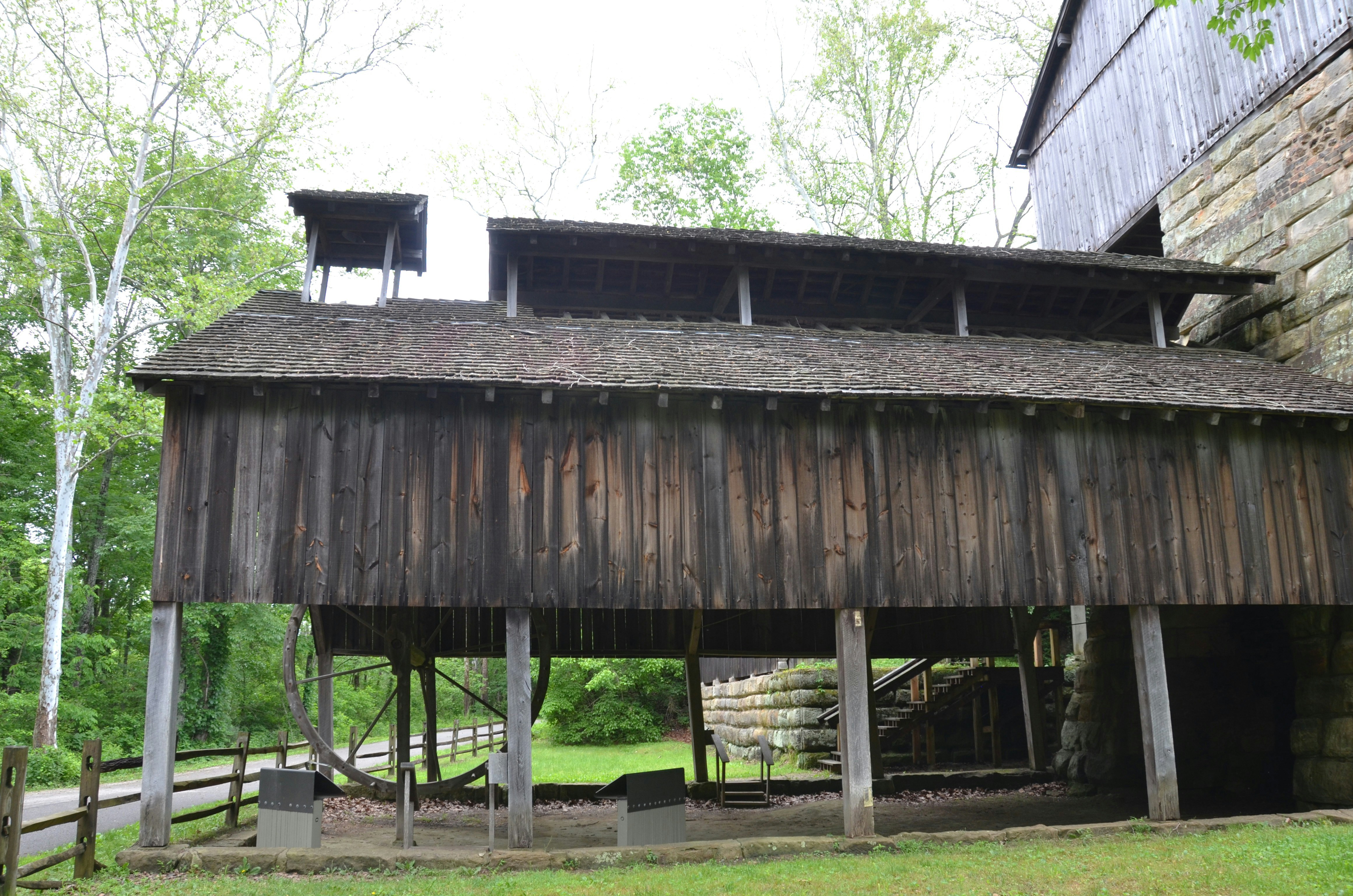 Weathered Timber Barn Overlooked by Greenery
