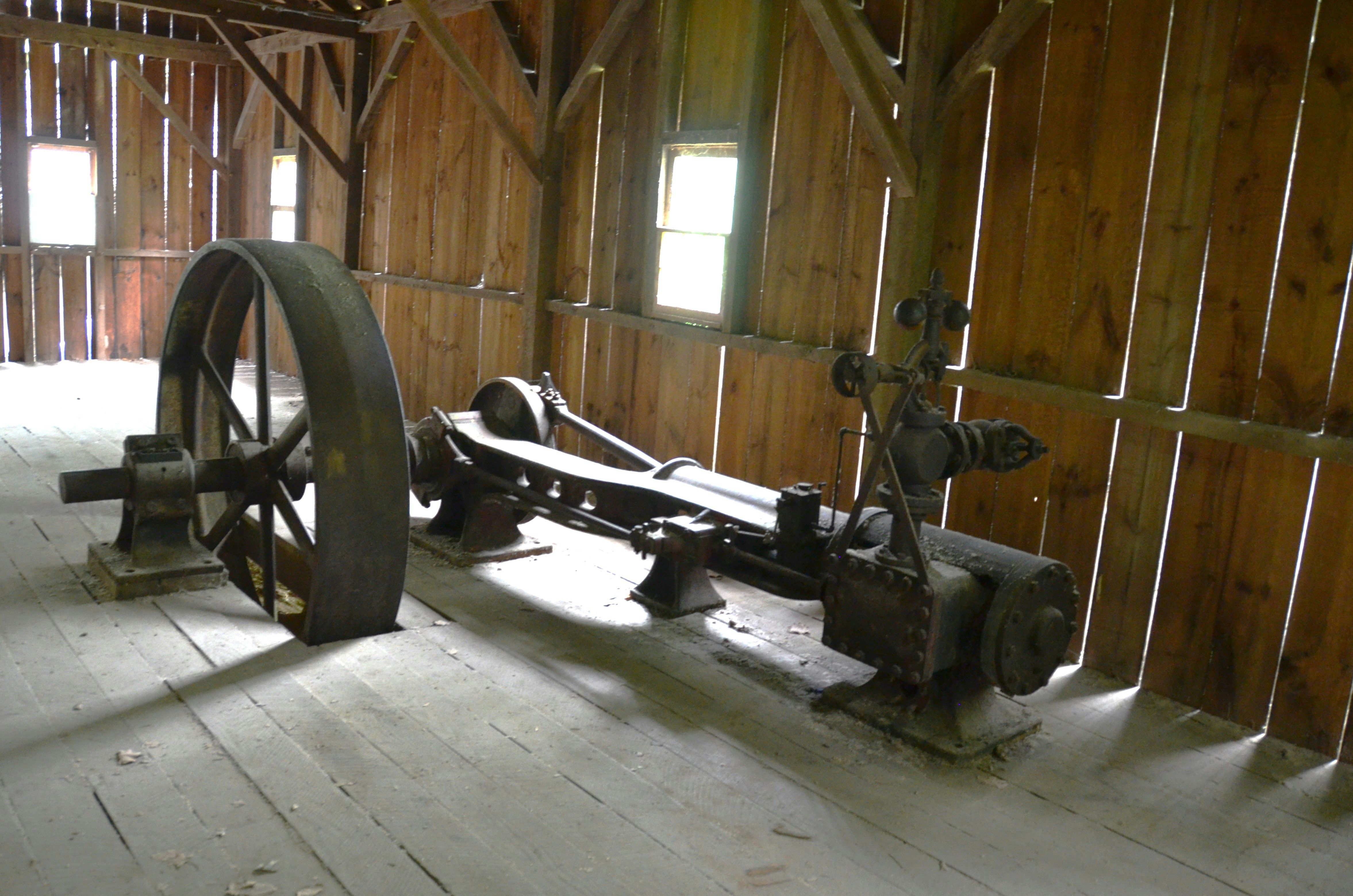 Victorian-era Lathe and Wheel within a Weathered Workshop