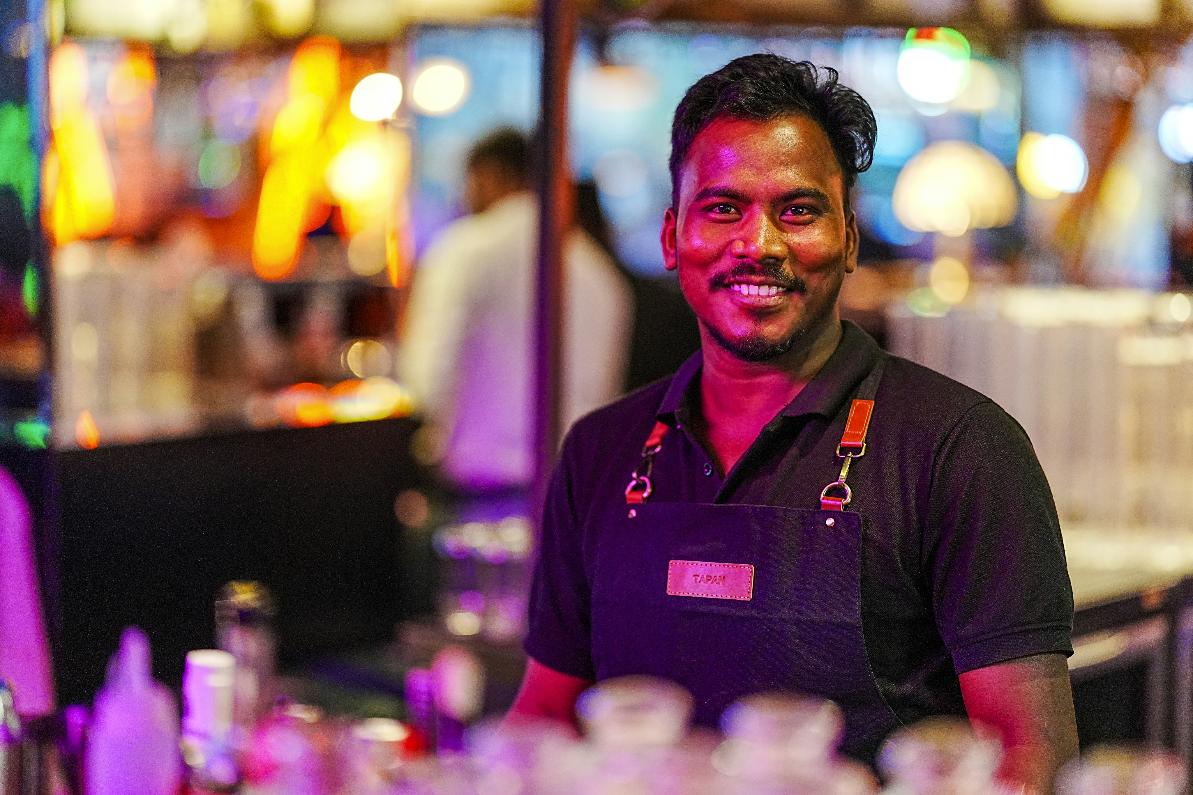 Cocktail Bar Portrait: Warm Light and Friendly Confidence