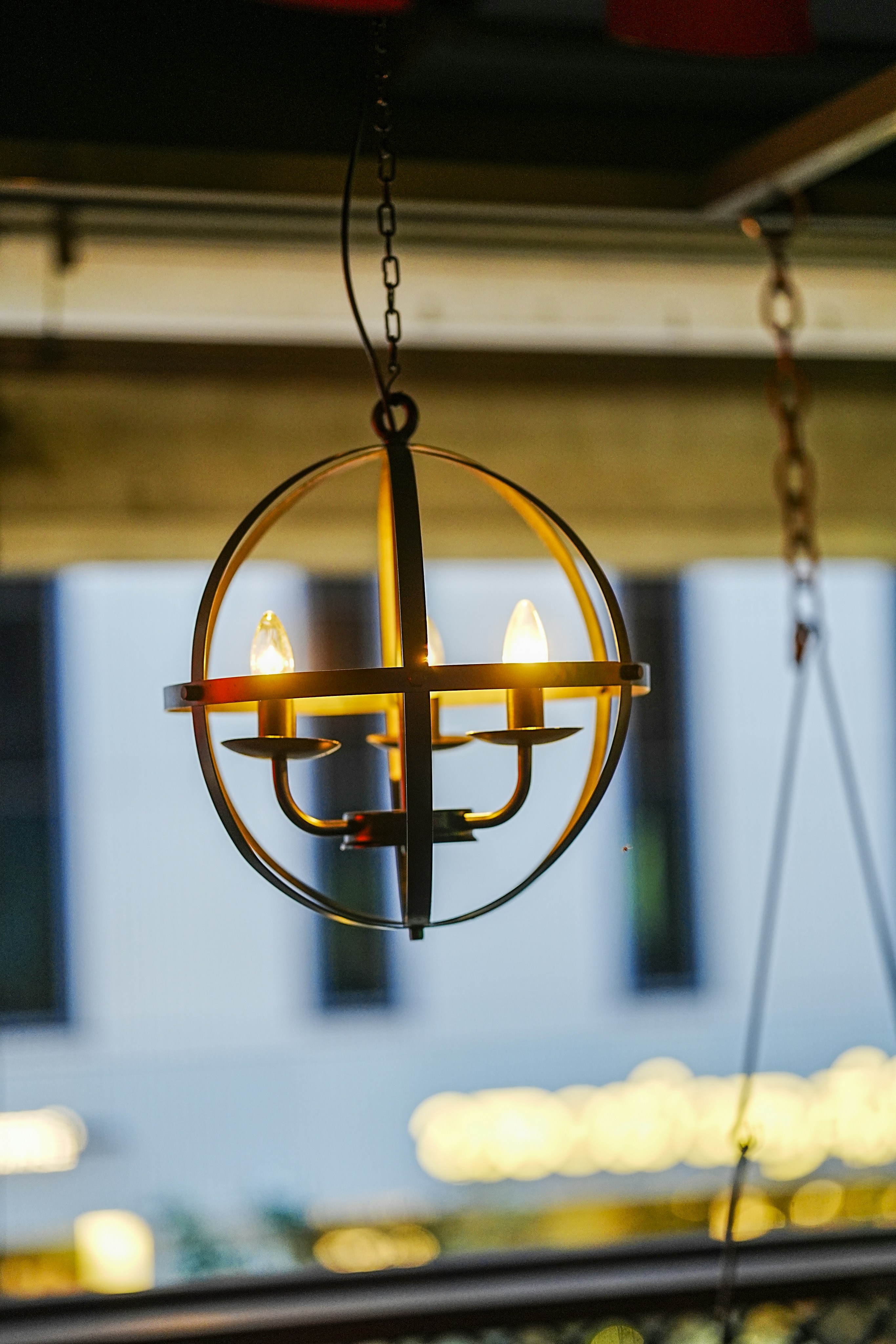 Ornate Orbital Chandelier Halos a Warm Evening