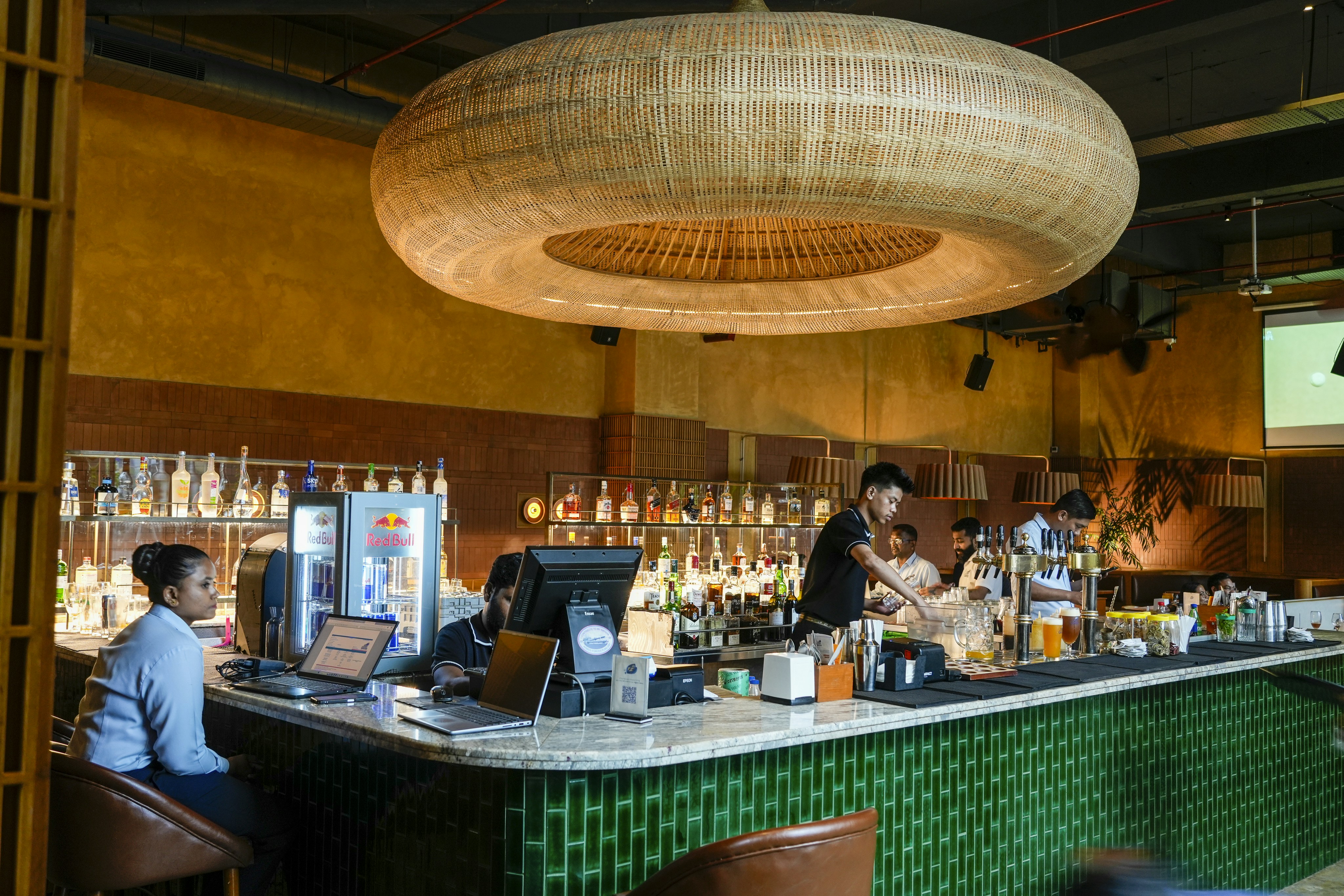 Amber Glow at the Bar: A Quiet Moment Behind the Counter