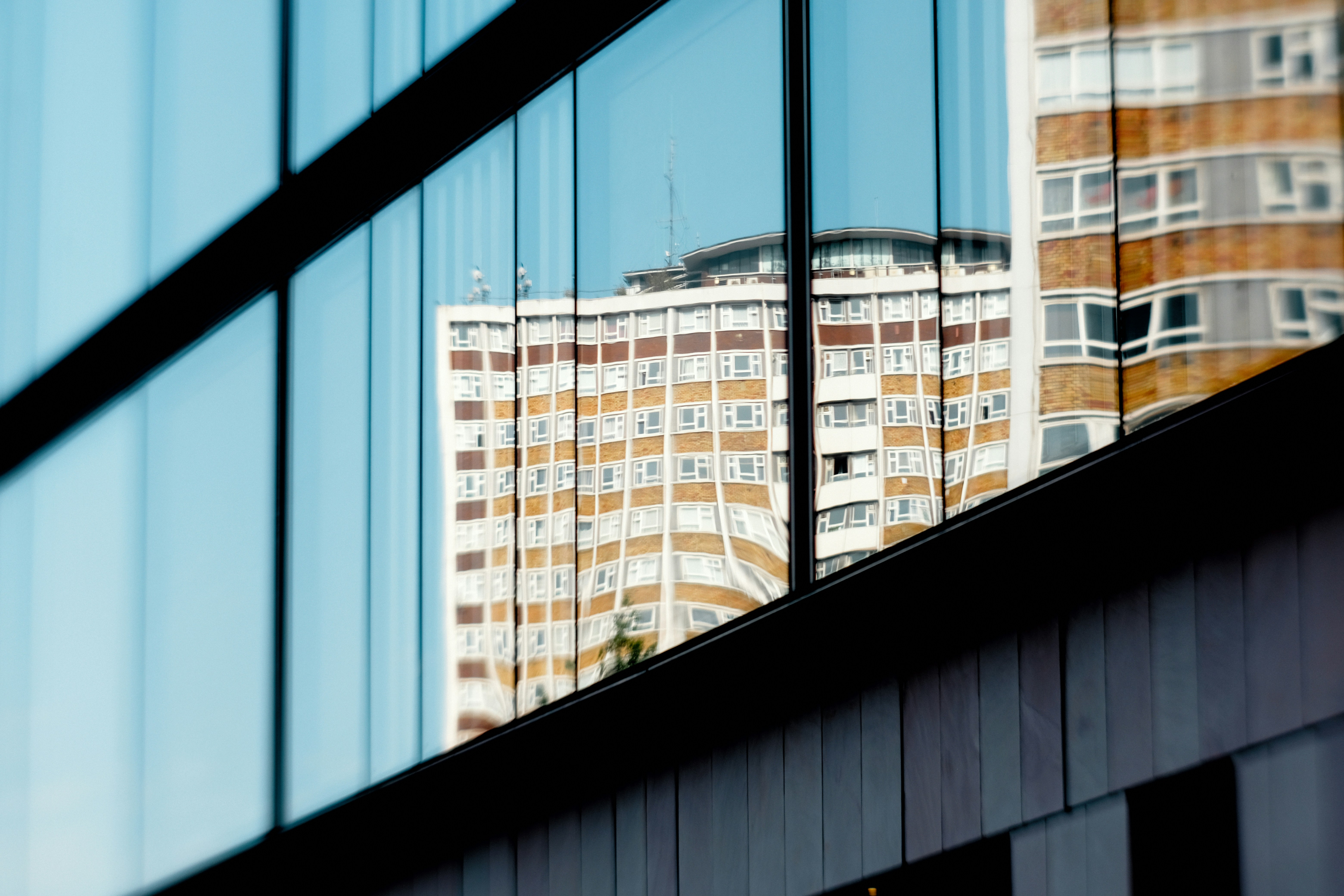 Urban building reflected in a modern glass facade. photo – Free ...