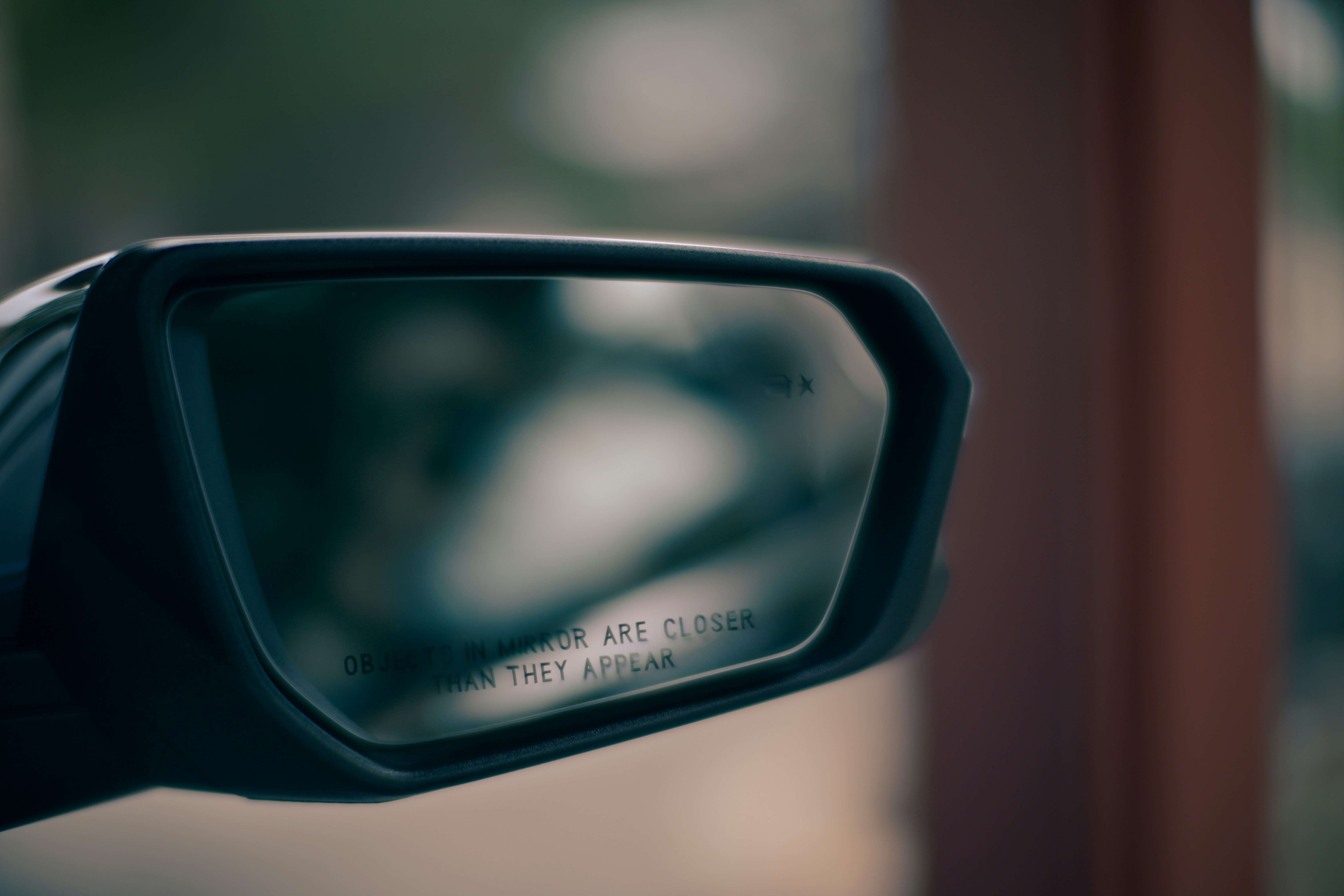 Car side mirror displaying the "objects are closer" warning. photo ...