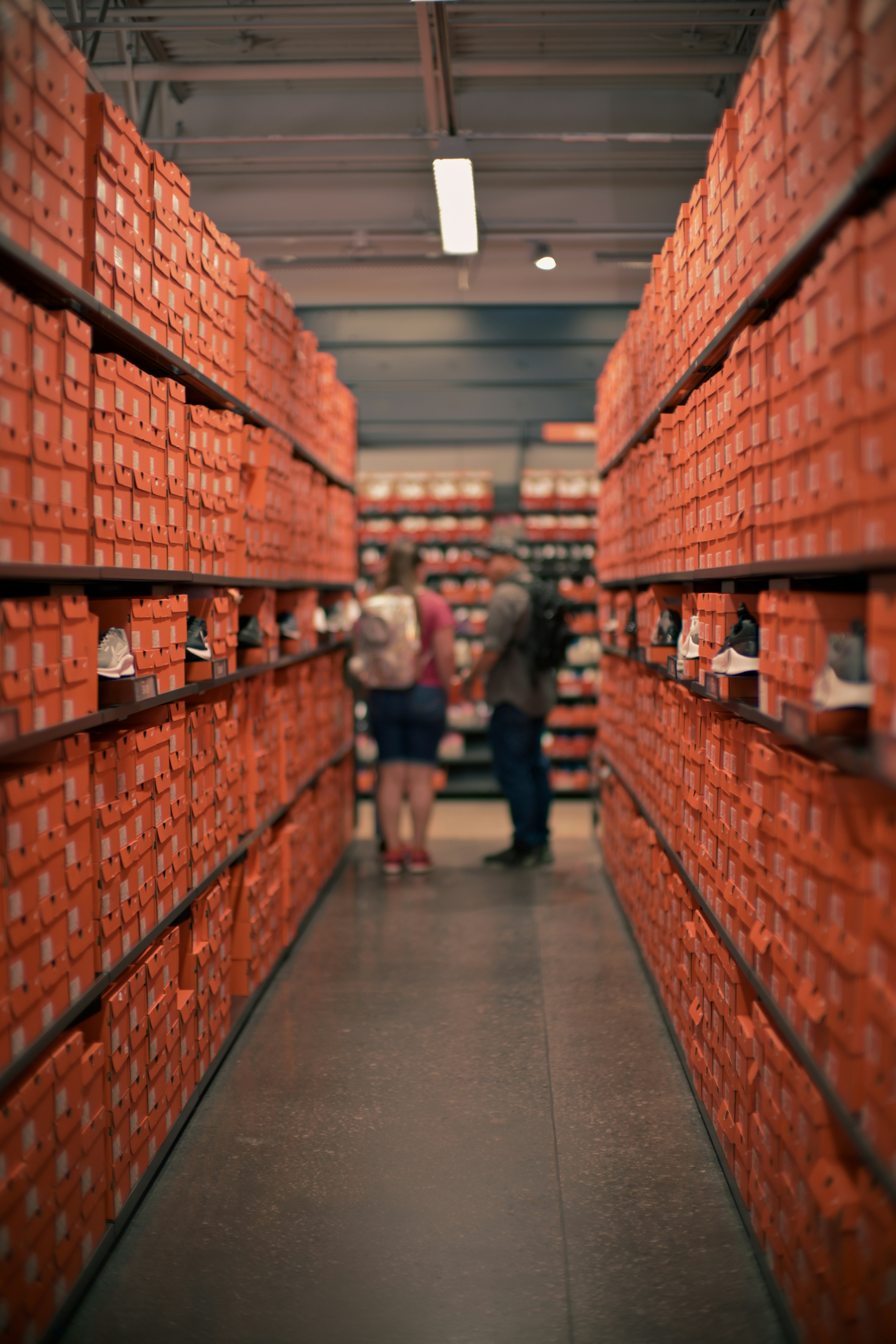 Axis of Boxes: Shoppers Centered Between Narrow Aisles