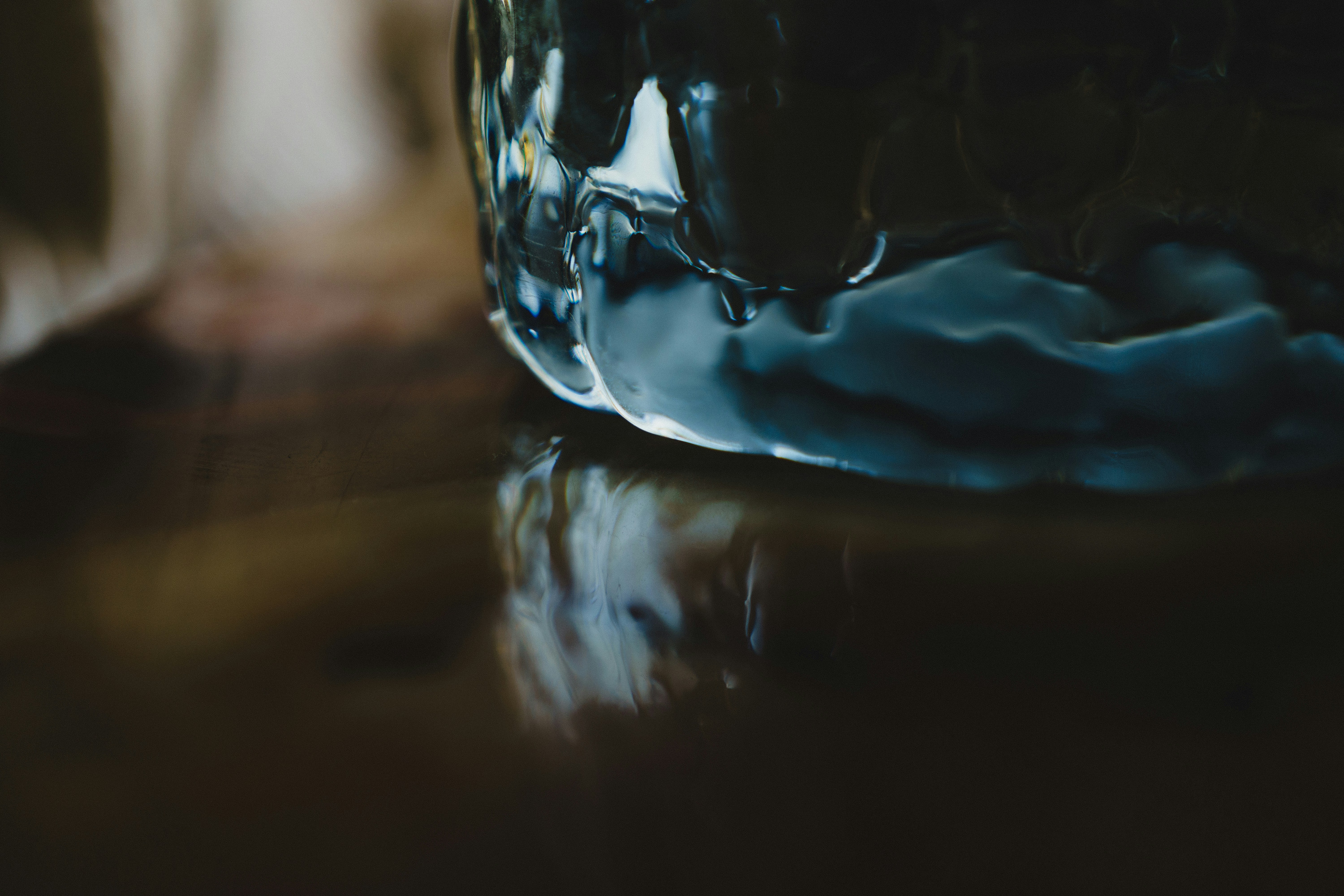 Liquid Mirror: A Close-Queued View of the Vase's Edge and Reflection