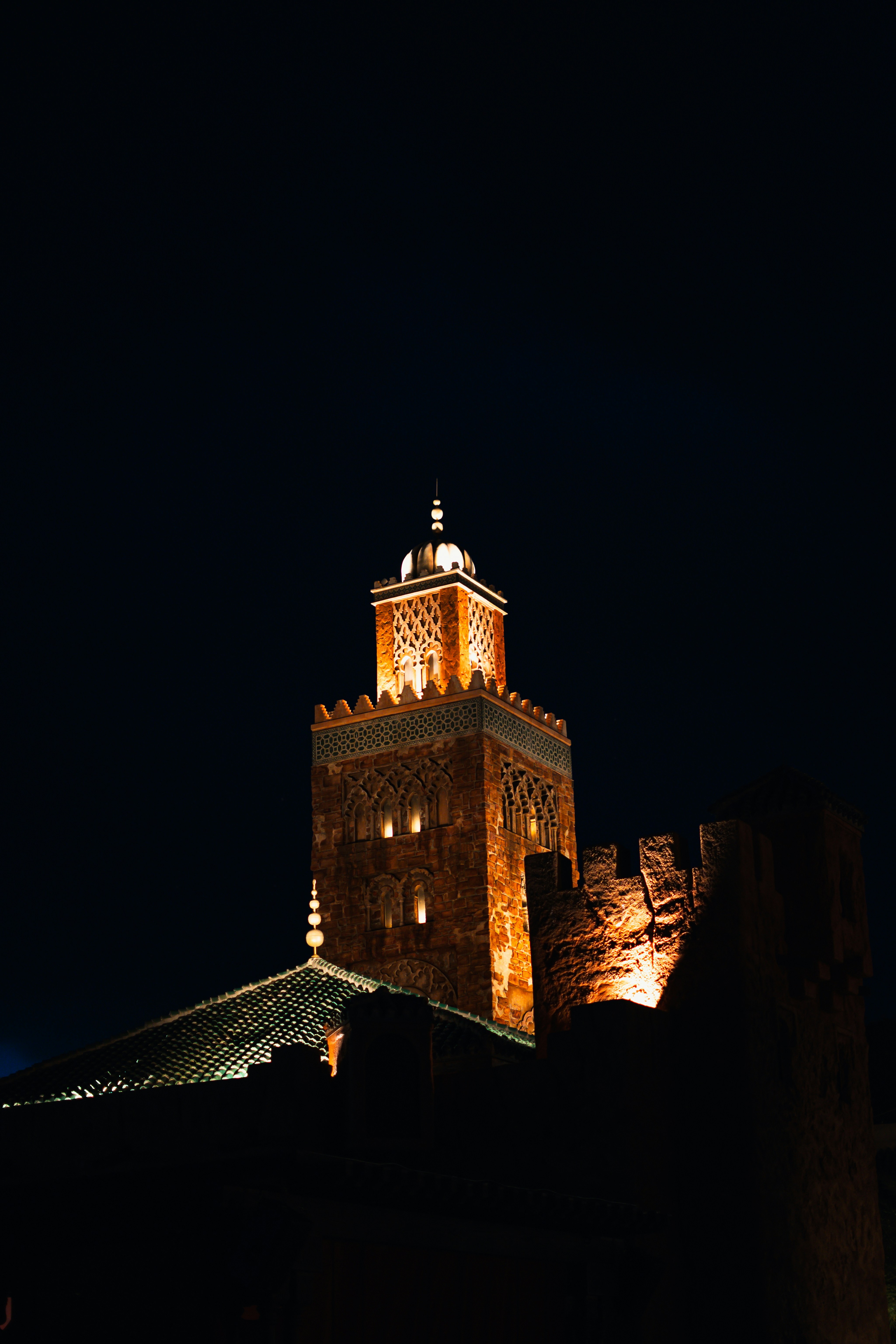 Moonlit Minaret: An Amber Tower Rising from the Night