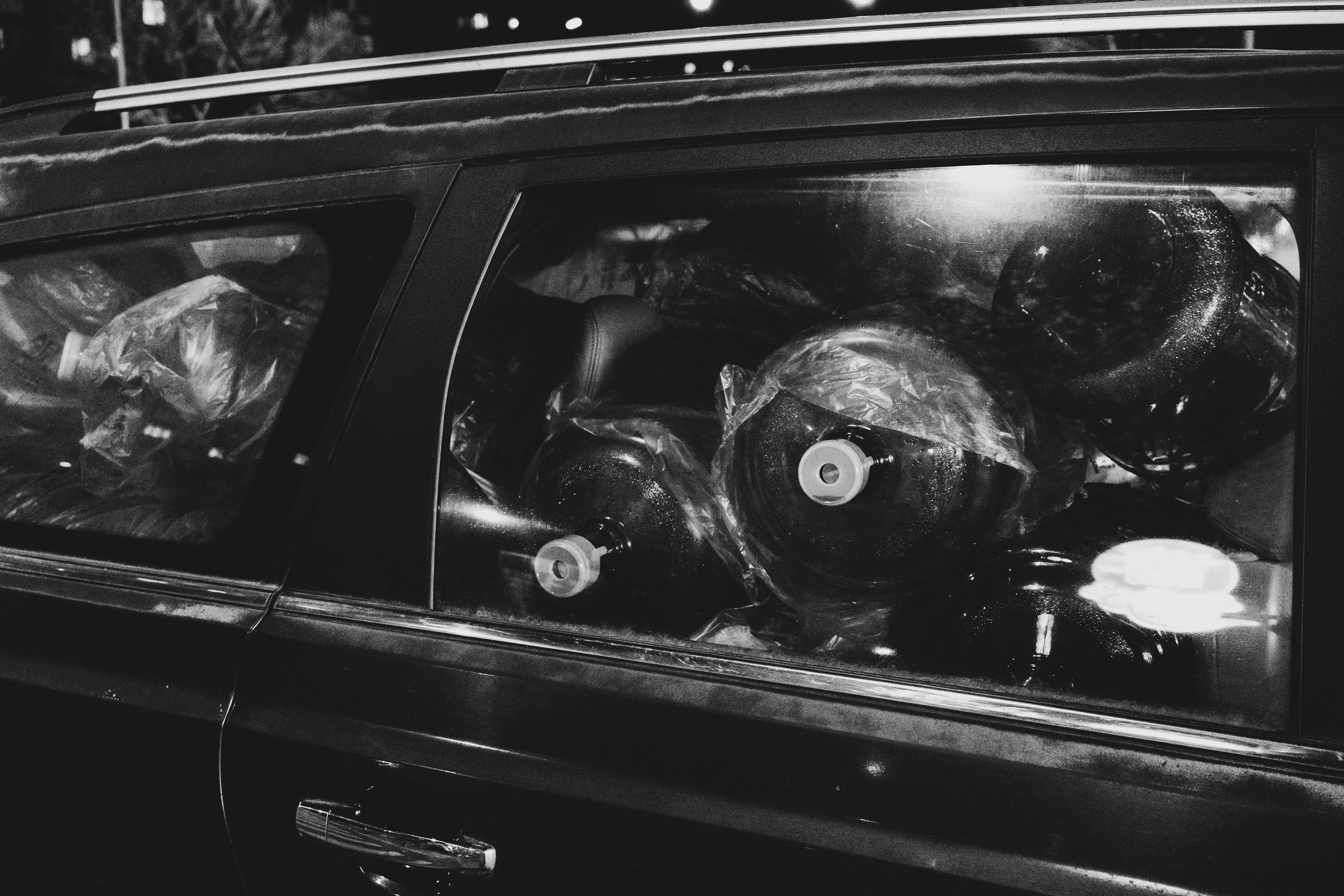 Loaded Car, Hidden Cargo: Night Glimpse into a Trunk Stow
