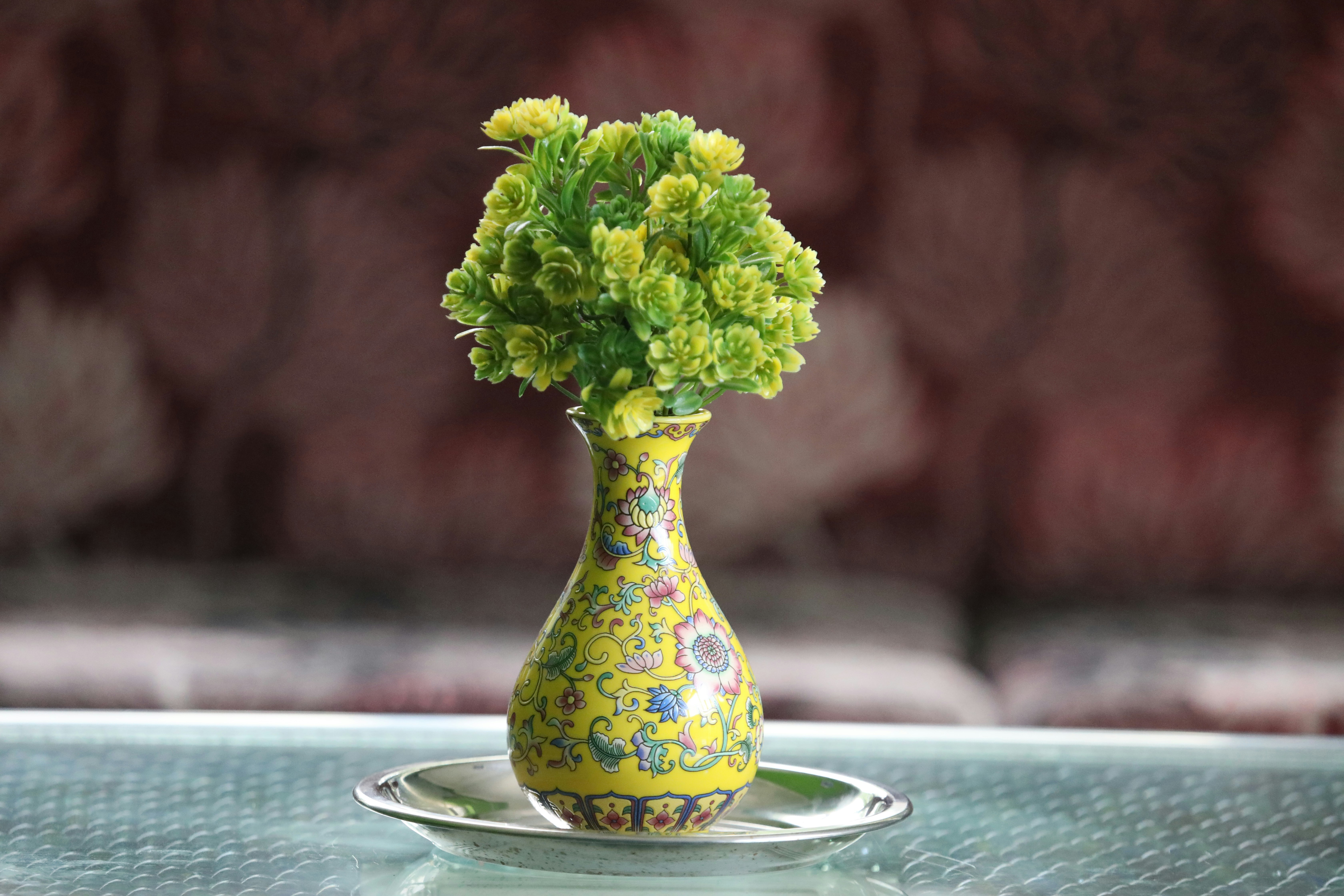 Miniature Vase with Green Bouquet: A Quiet Moment on Glass Table