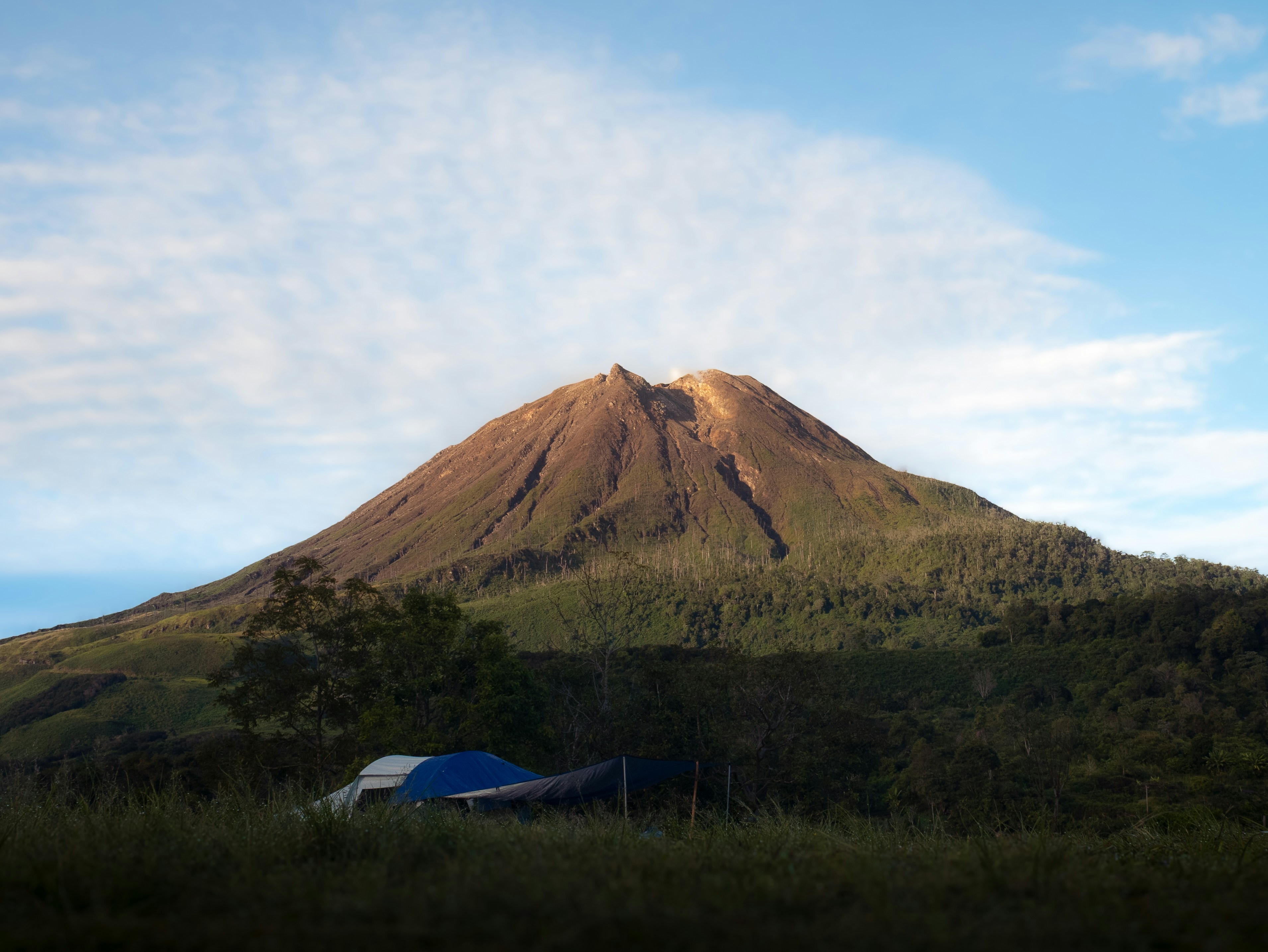 Sunlit Cone: A Mountain Under a Clear Sky