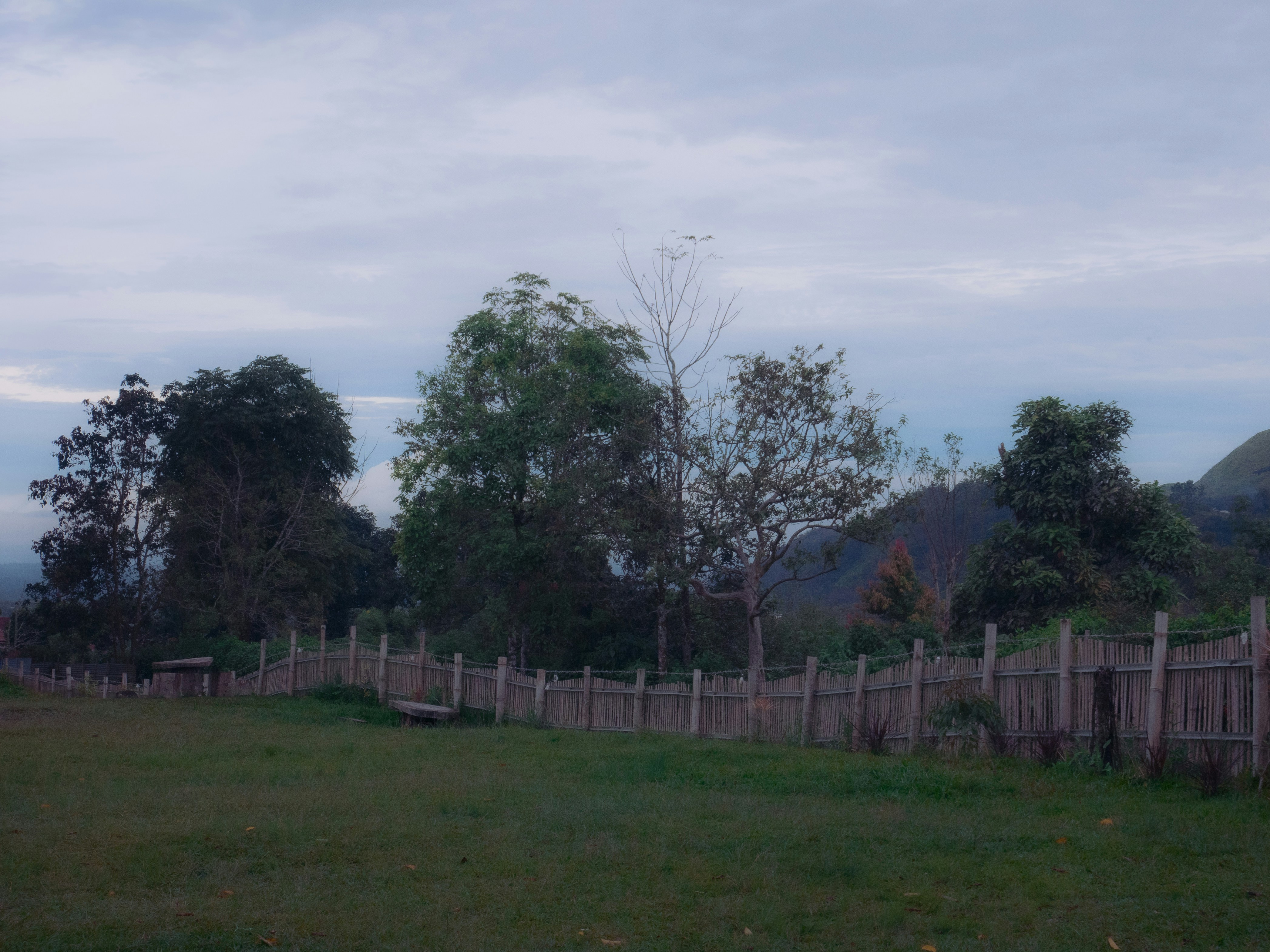Fence Line and Distant Hills: Quiet Rural Boundary
