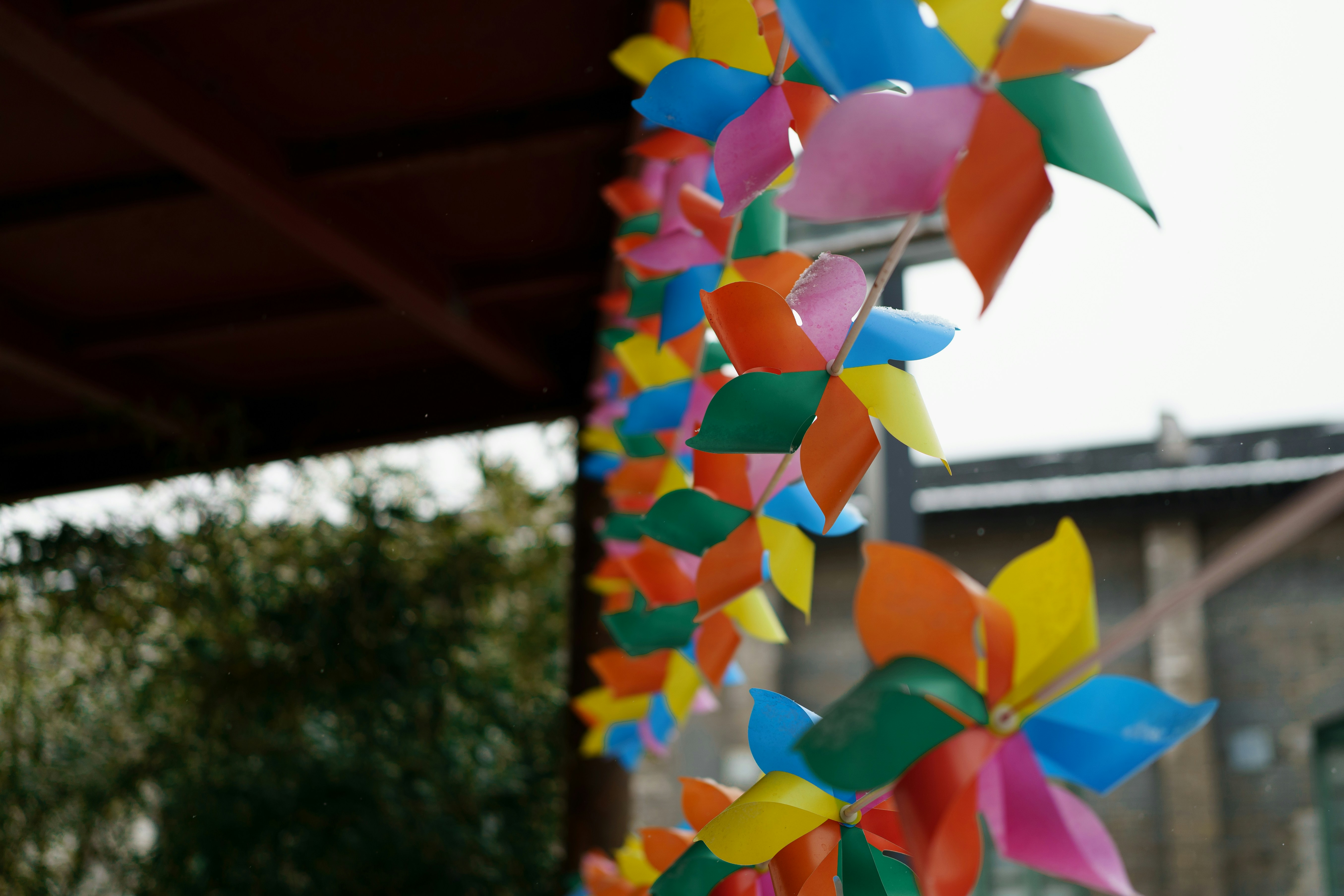 Colorful Pinwheels in Sunlit Archway