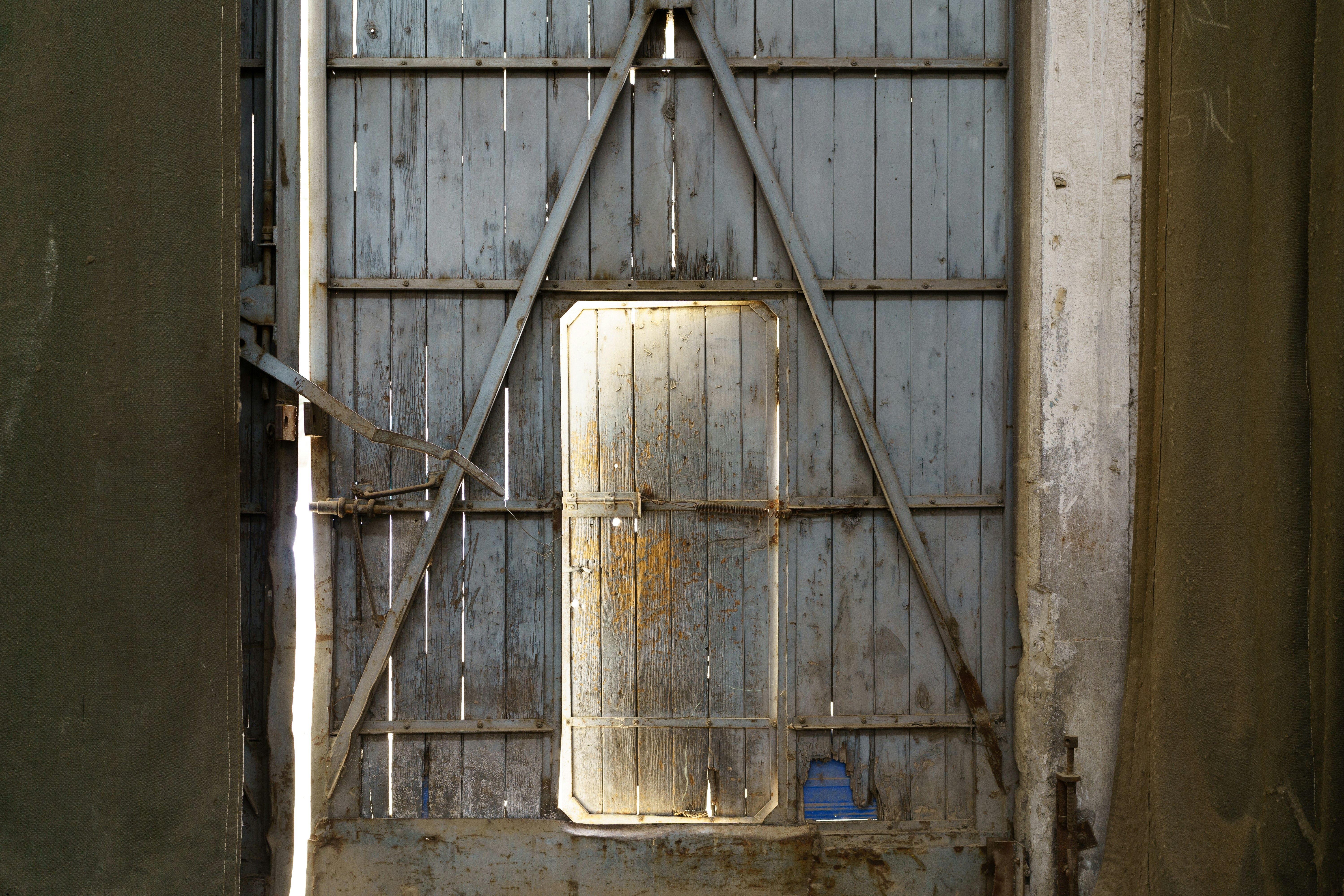 Backlit doorway in a weathered industrial interior
