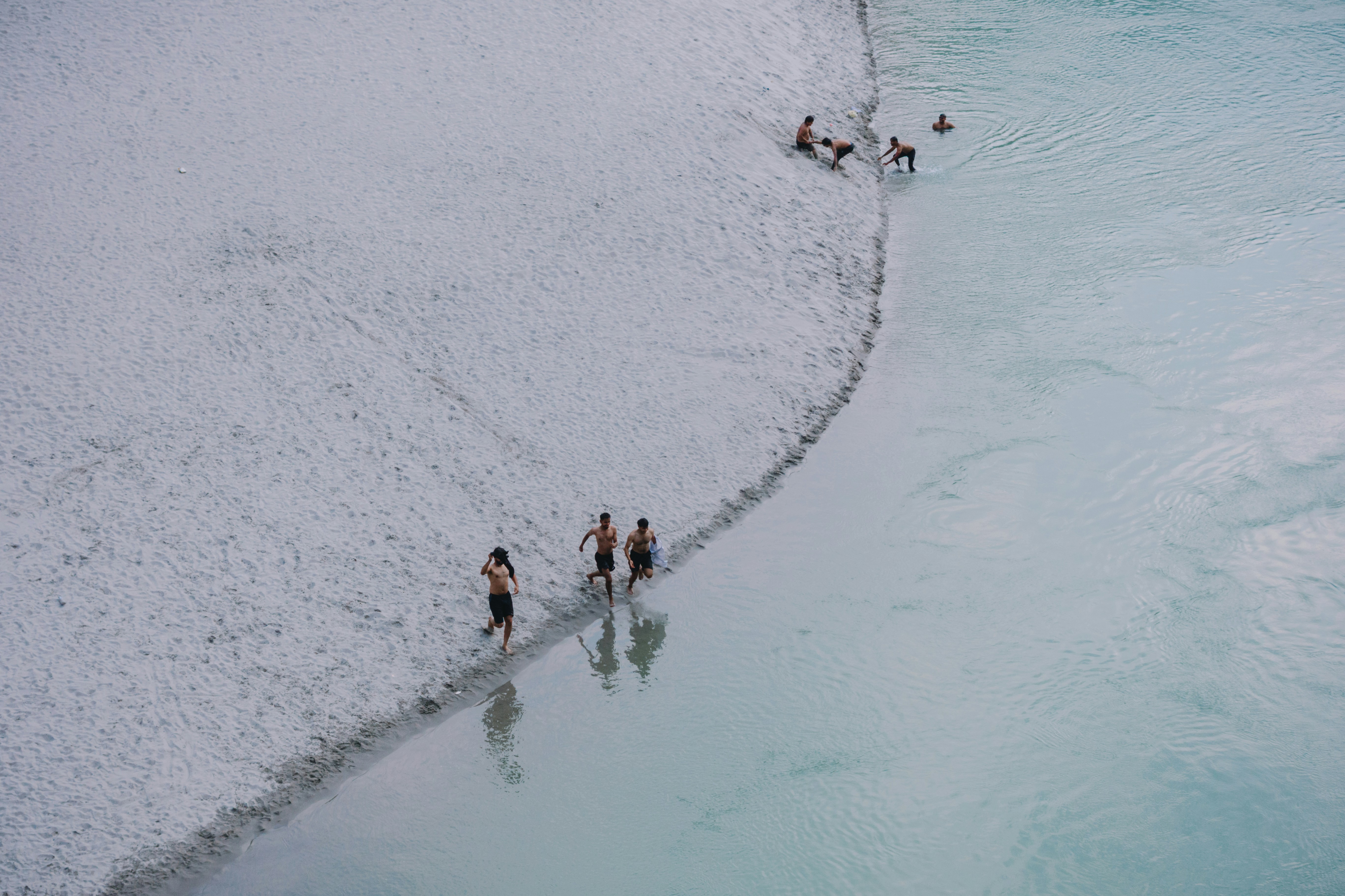 Edge of the Bright Shore: Figures in a Turquoise Tide
