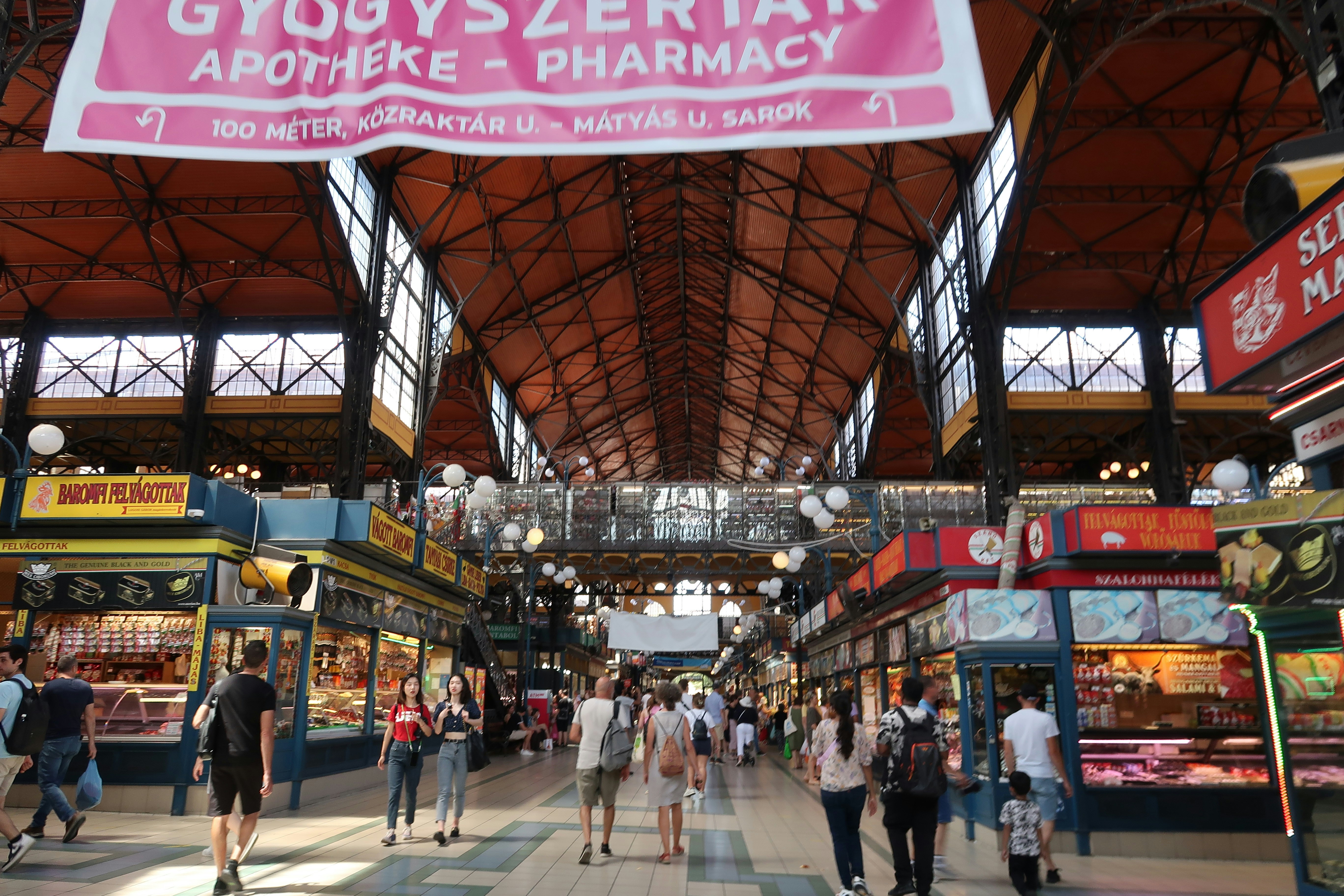 Market Hall Convergence: A Corrugated Vault of Color and People