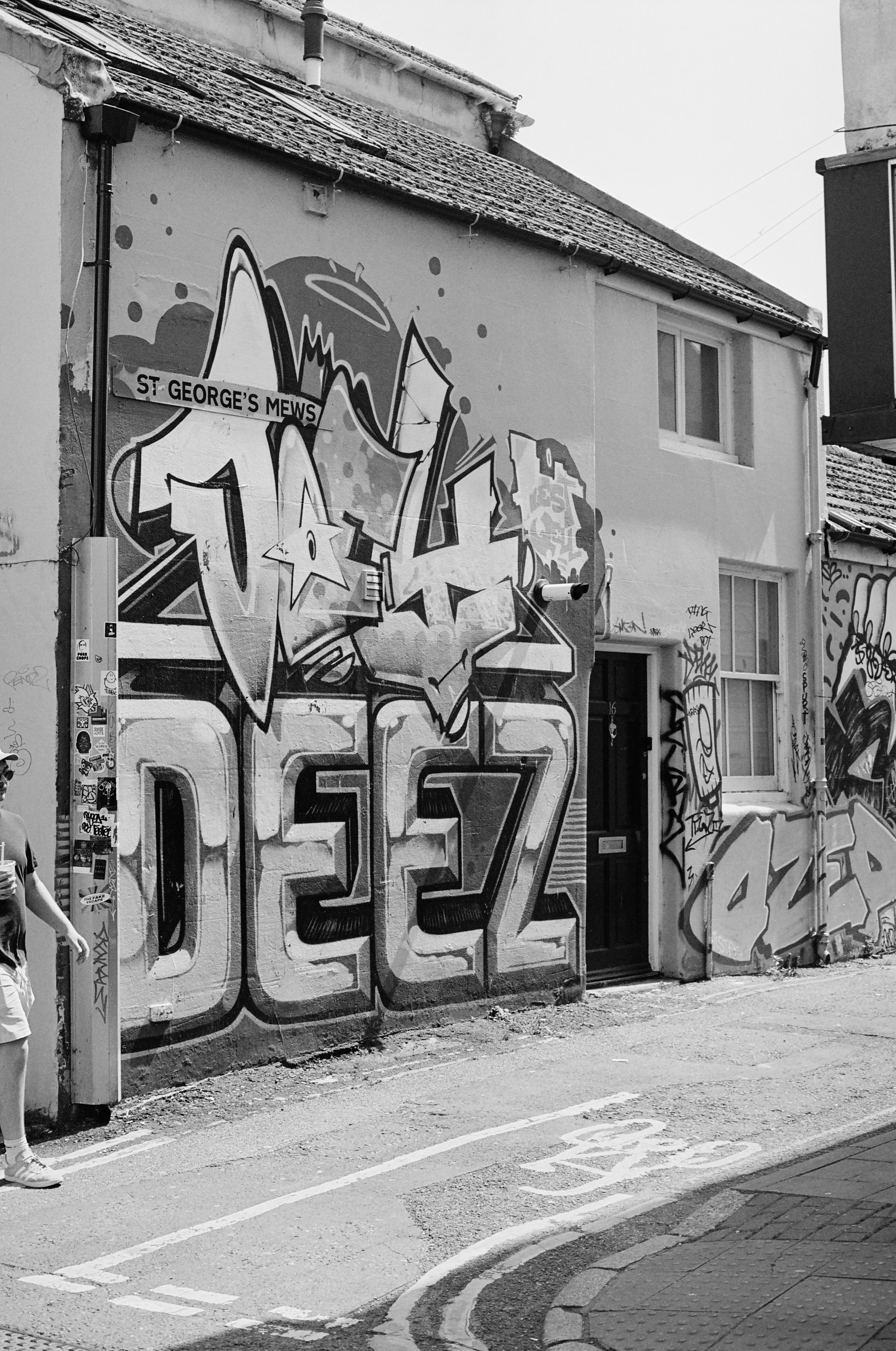 Black and white building covered in bold graffiti art. photo – Free ...