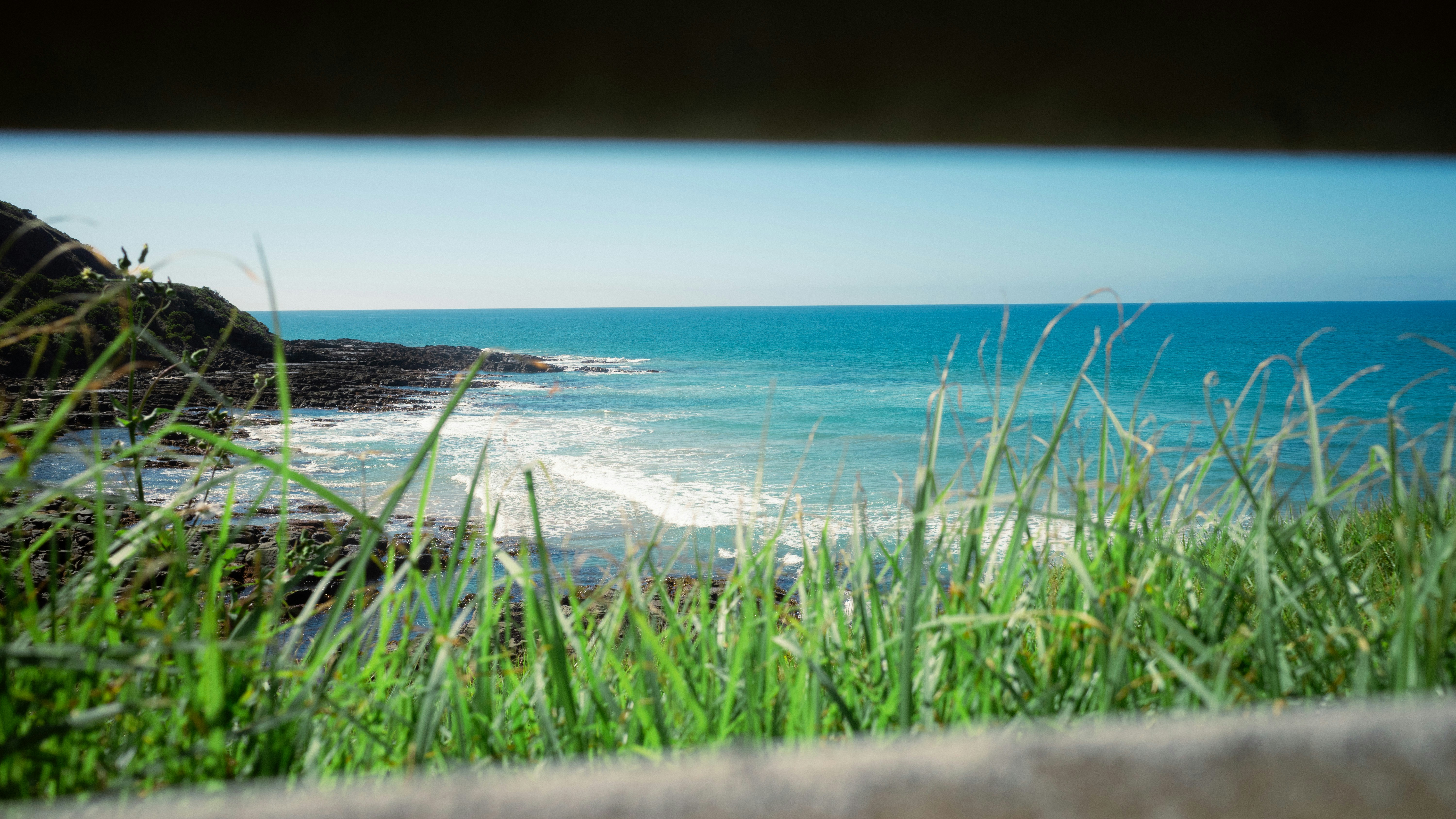 Sea View Through Framed Grass Gap