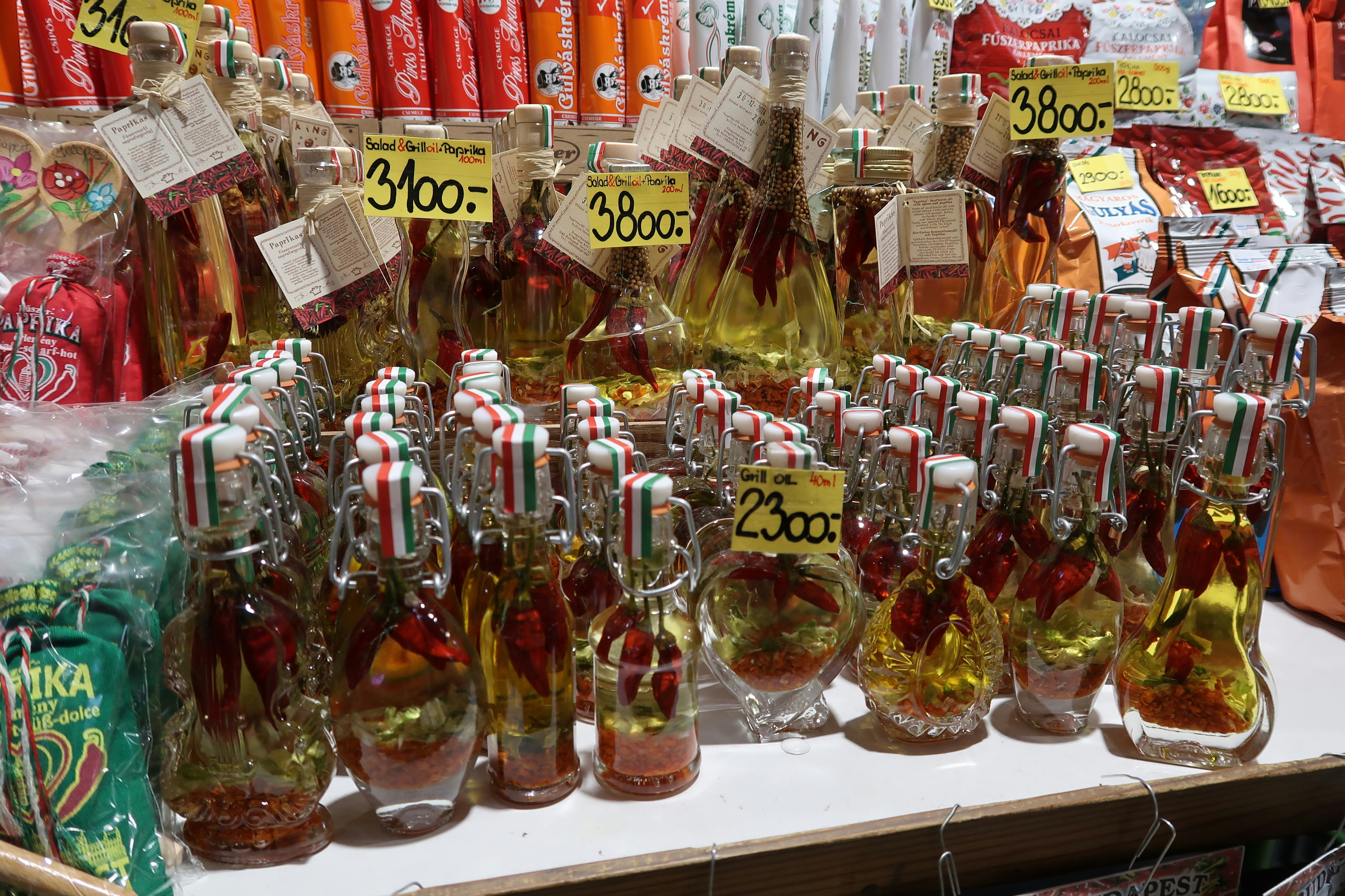 Row of Glass Bottles with Candy-Cane Stripes on a Market Shelf