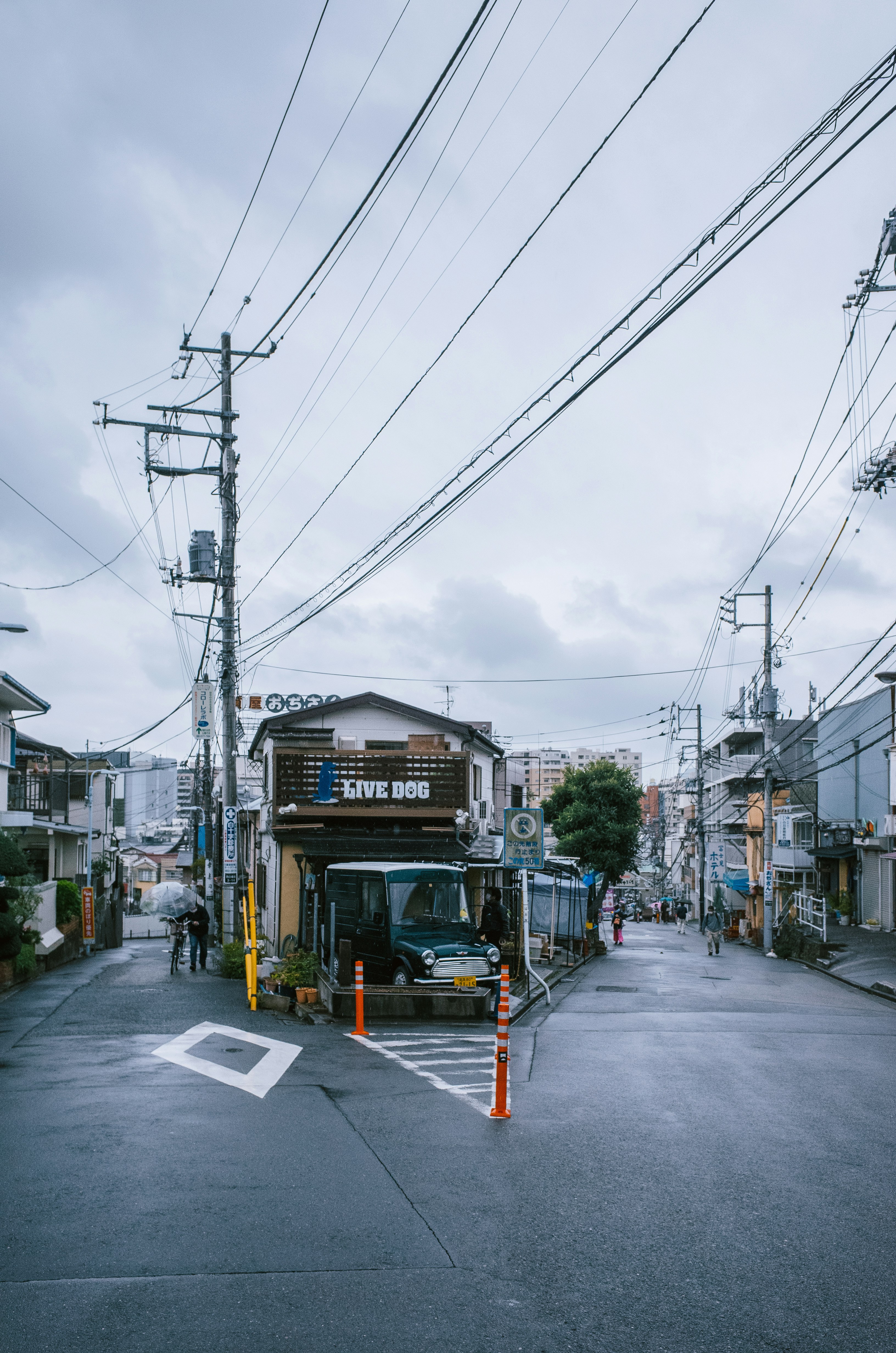 Street Corner Café Under a Web of Utilities