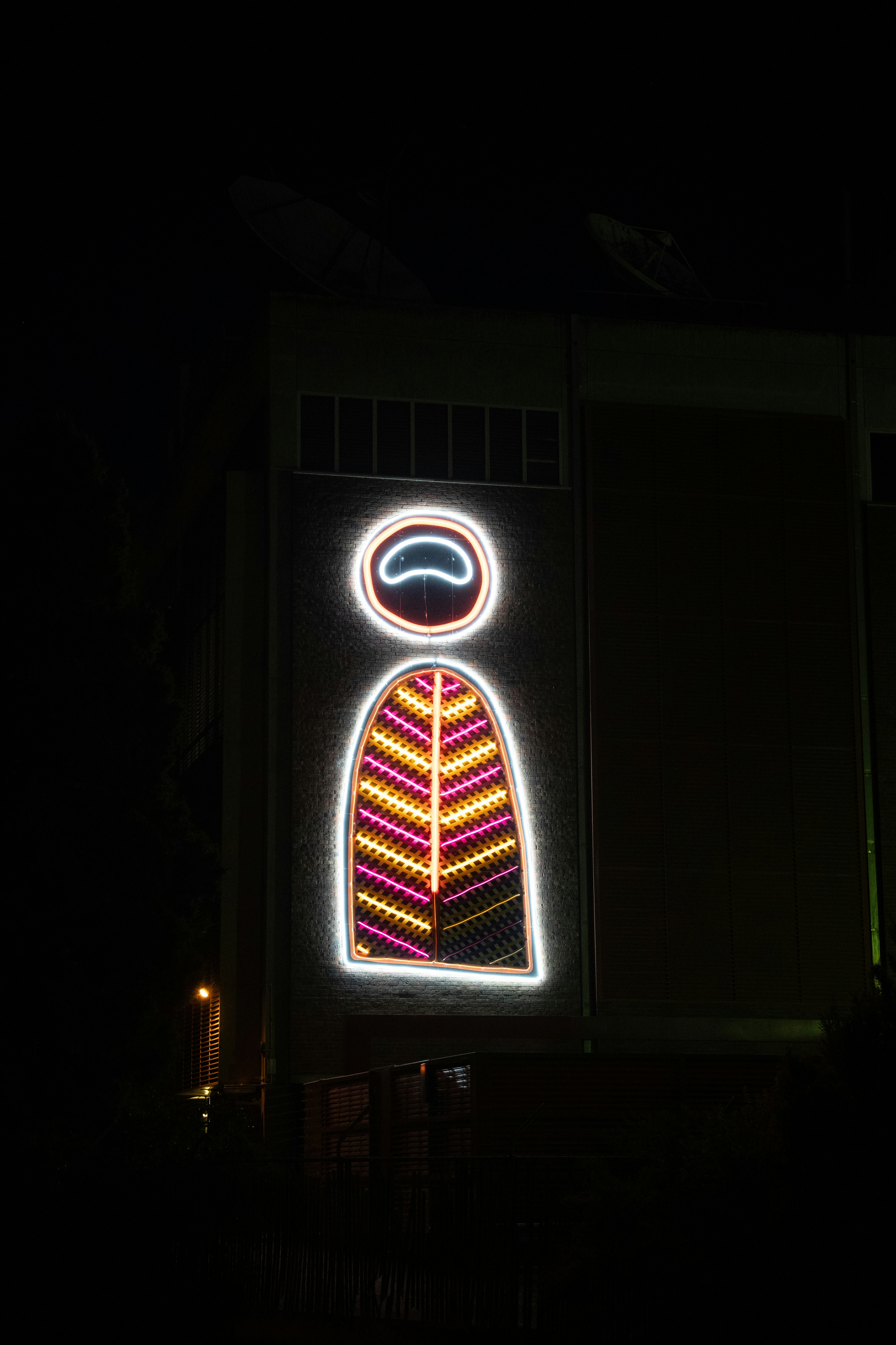 Neon Kaleidoscope: A Towering Iris Adorned in Lights
