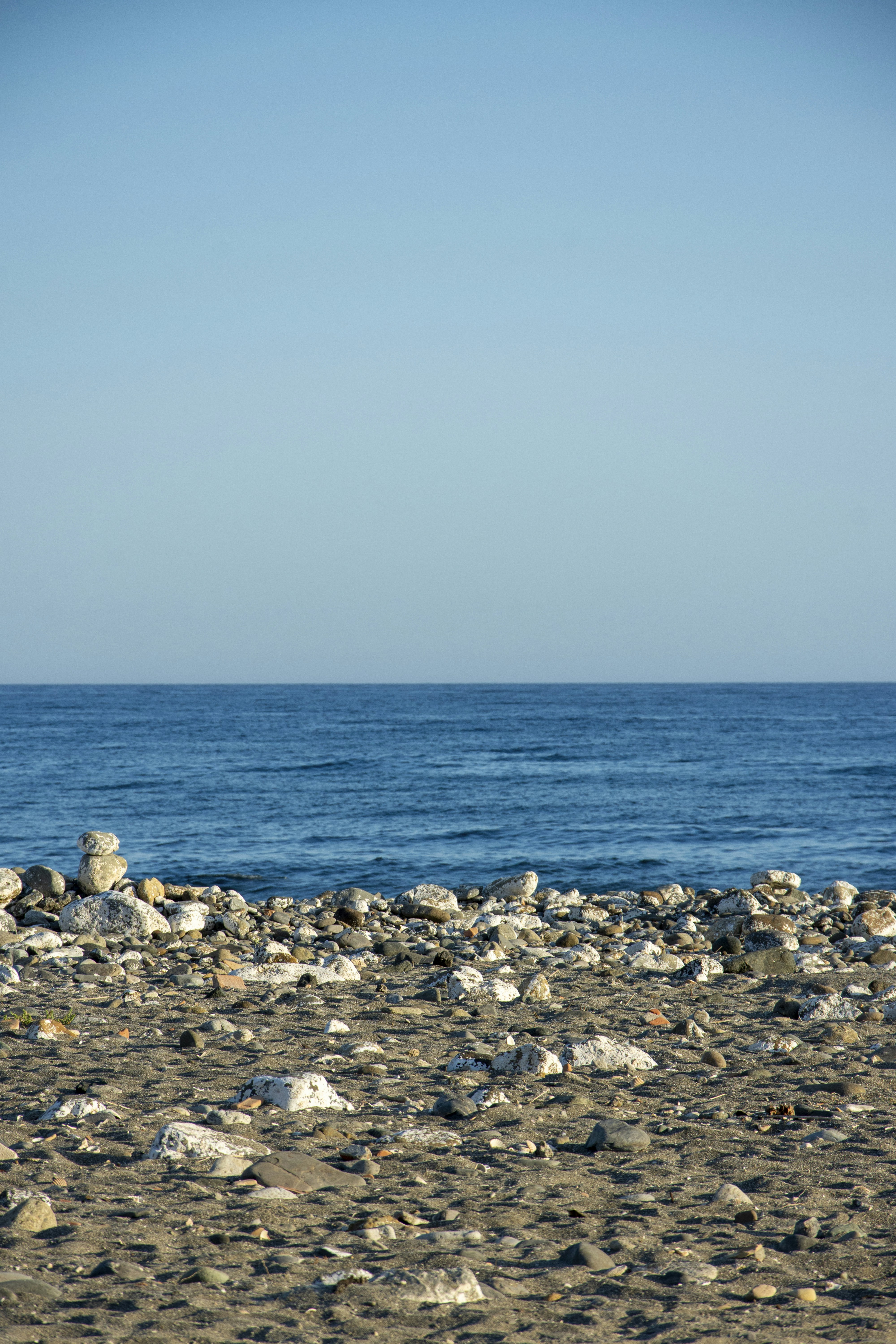 Rugged shoreline beneath a calm horizon