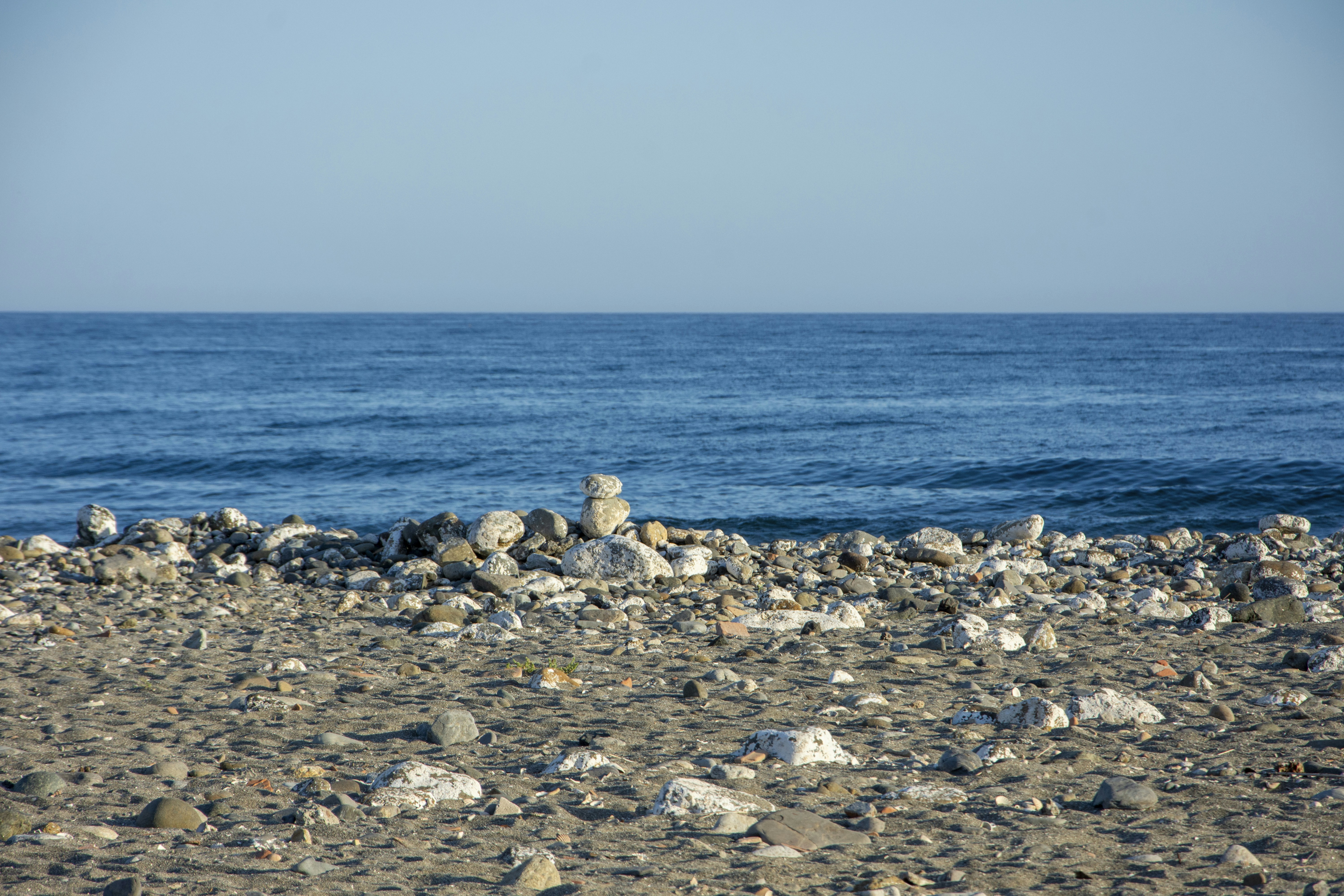 Rugged shoreline under a calm horizon