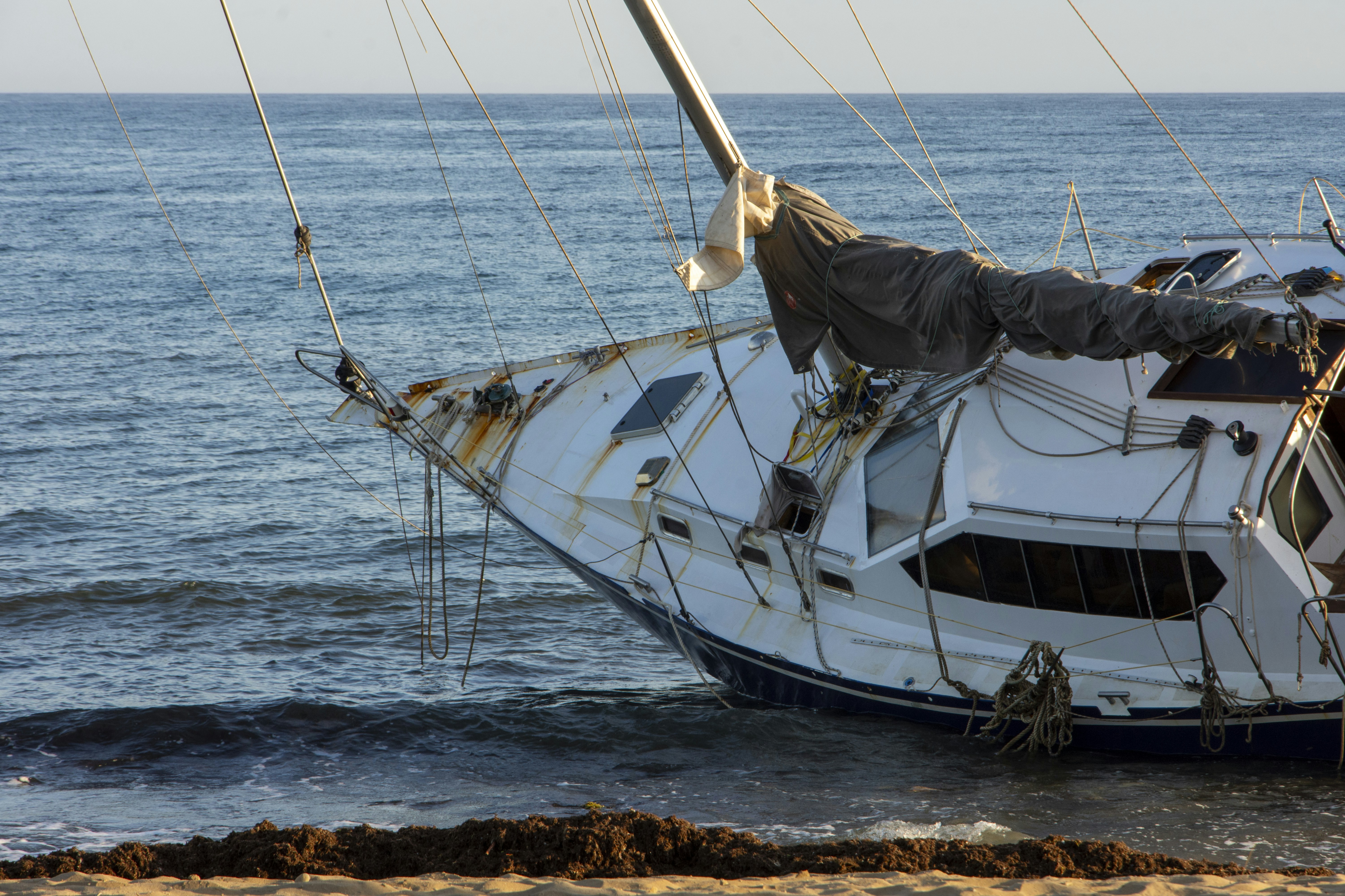 Derelict Sloop Gracing a Quiet Sea