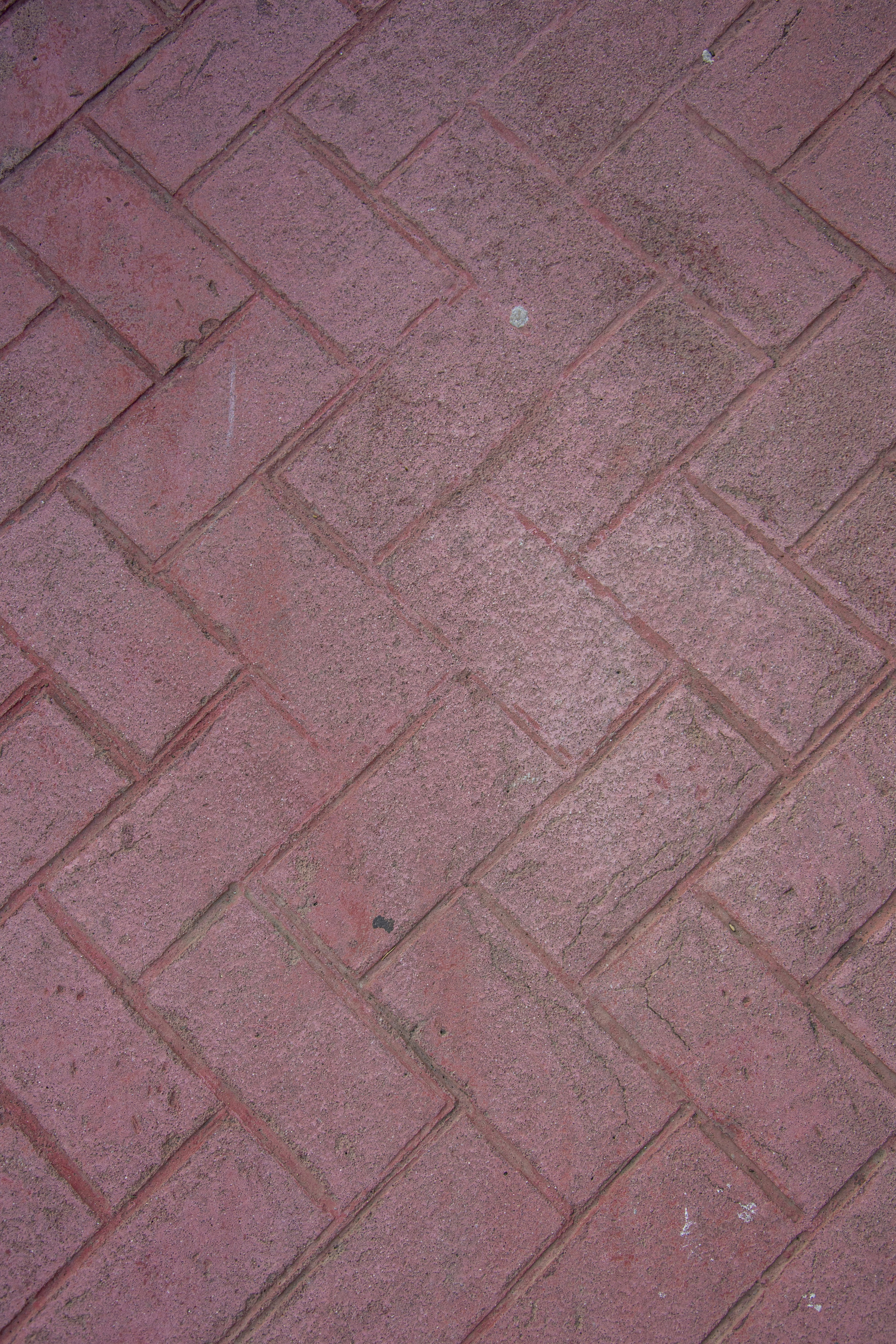 Crimson Tile Pattern: A Diagonal Mosaic of Red Brick Pavers