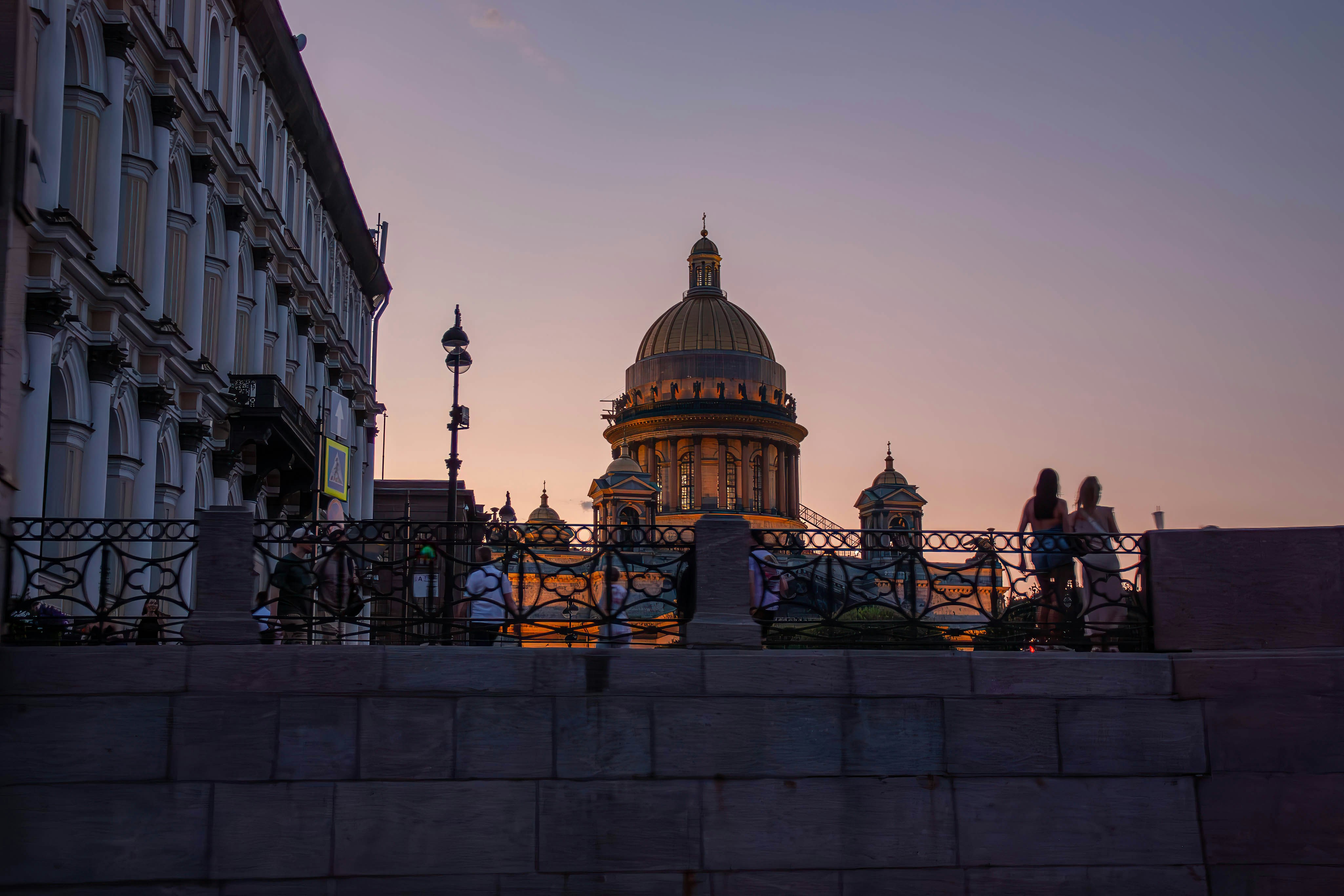 Dusk on the Neva: Domelit City Silhouette from the Riverside Walk