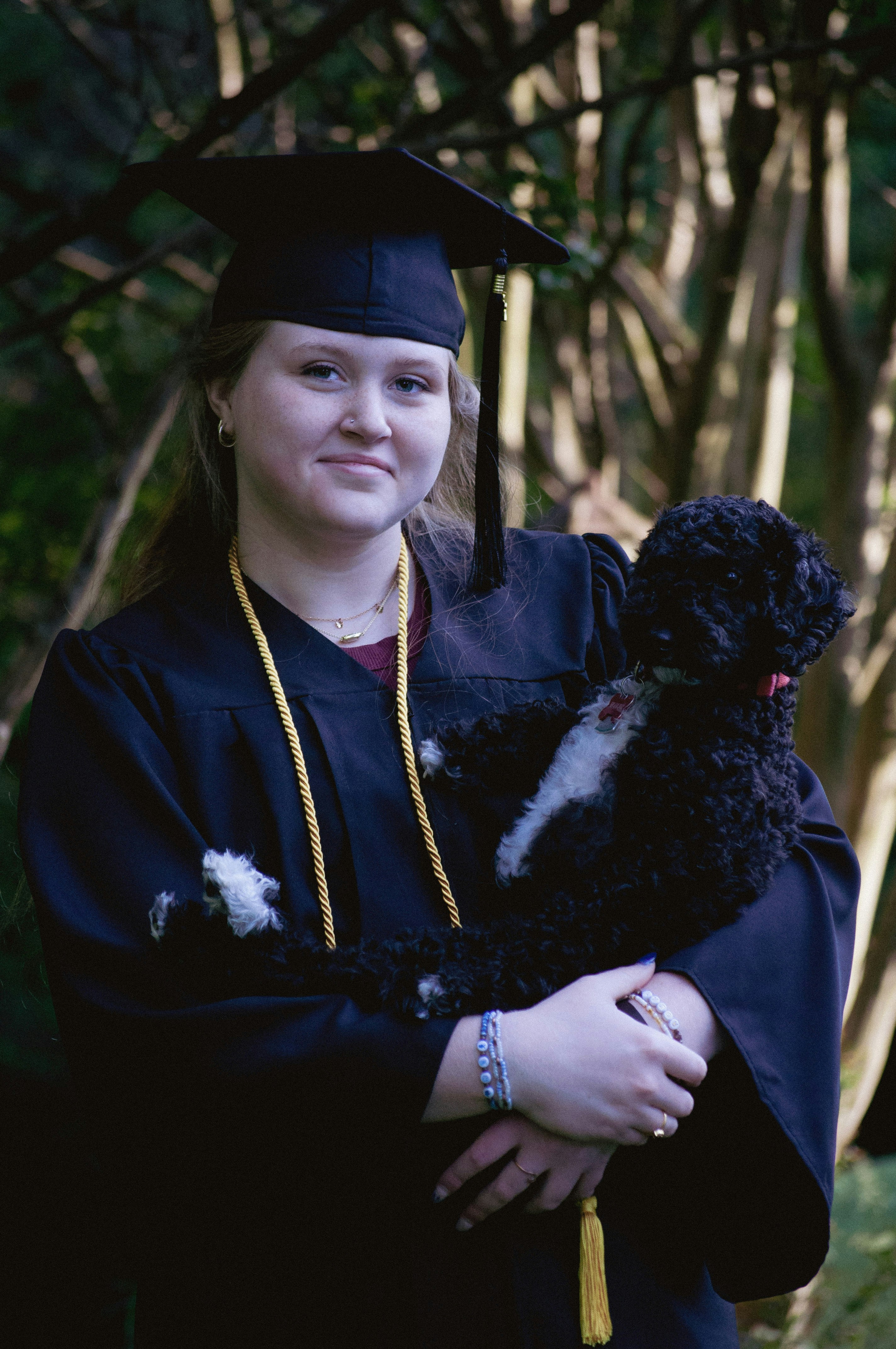 Graduate in Focus: A Quiet Moment with the Poodle in Tow