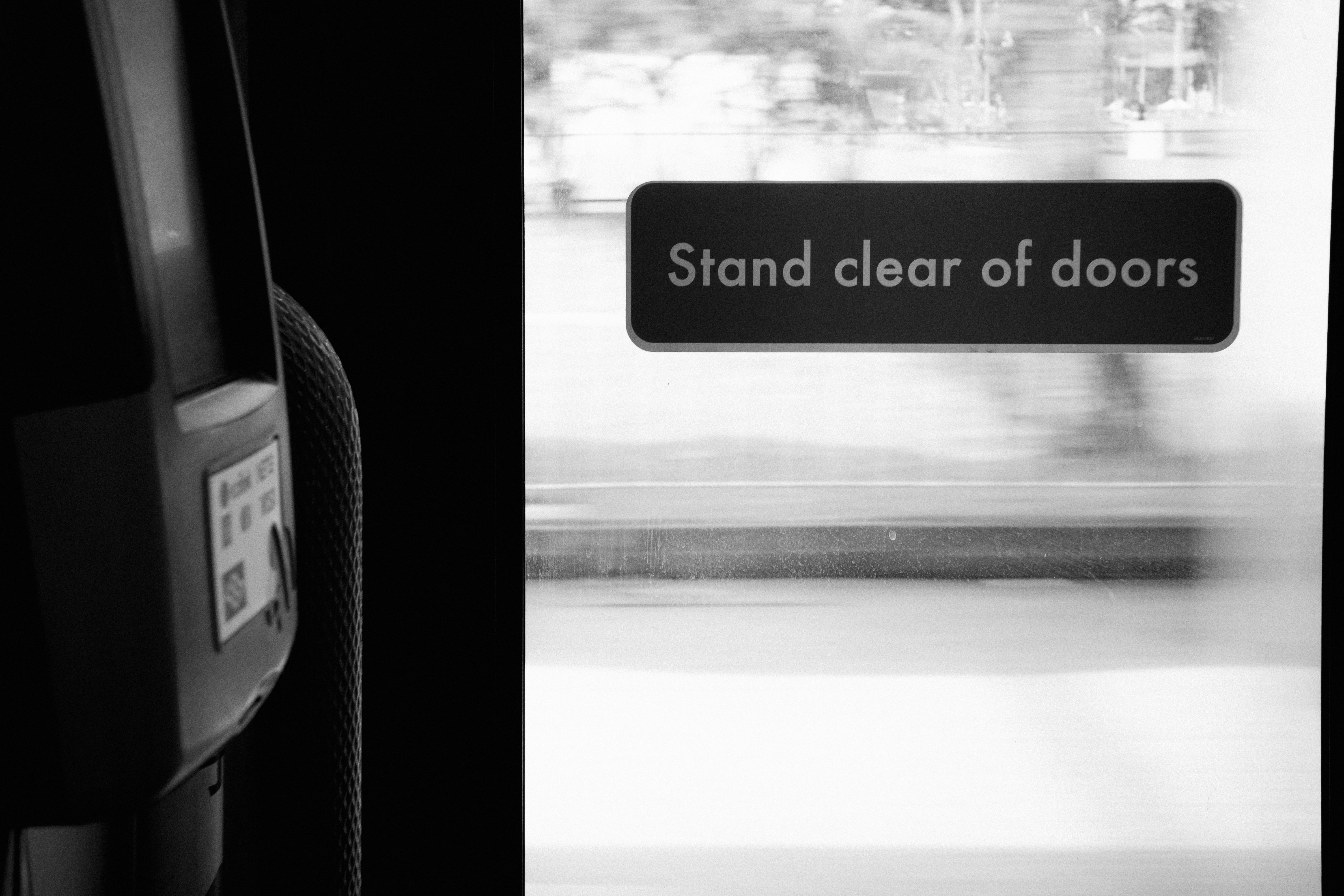 Stand Clear of Doors: A Quiet Moment Inside a Moving Train