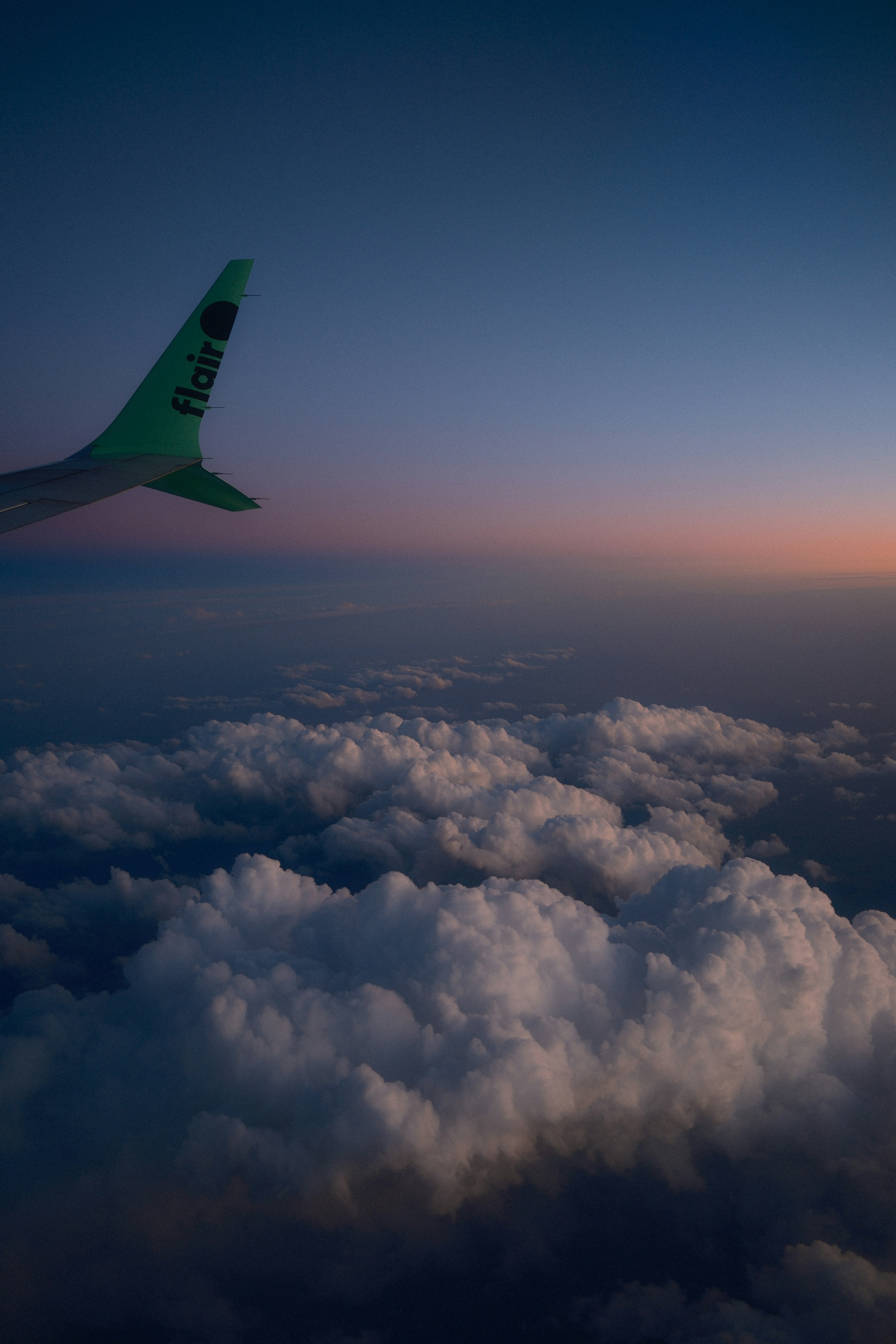Sunset Over Clouds with FlaiR Tail Fin