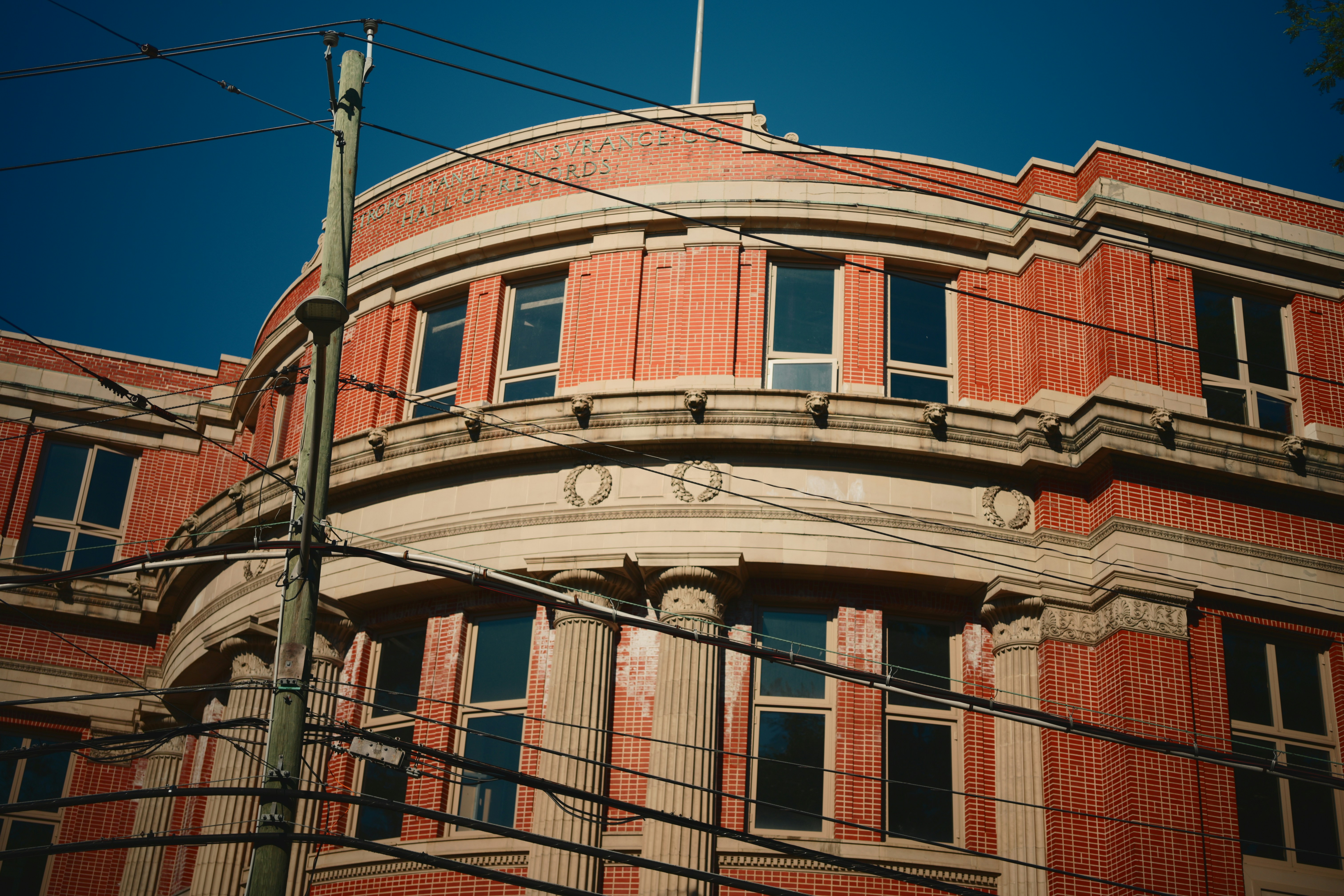 Brick and Beam: A Historic Corner Wrapped in Wires