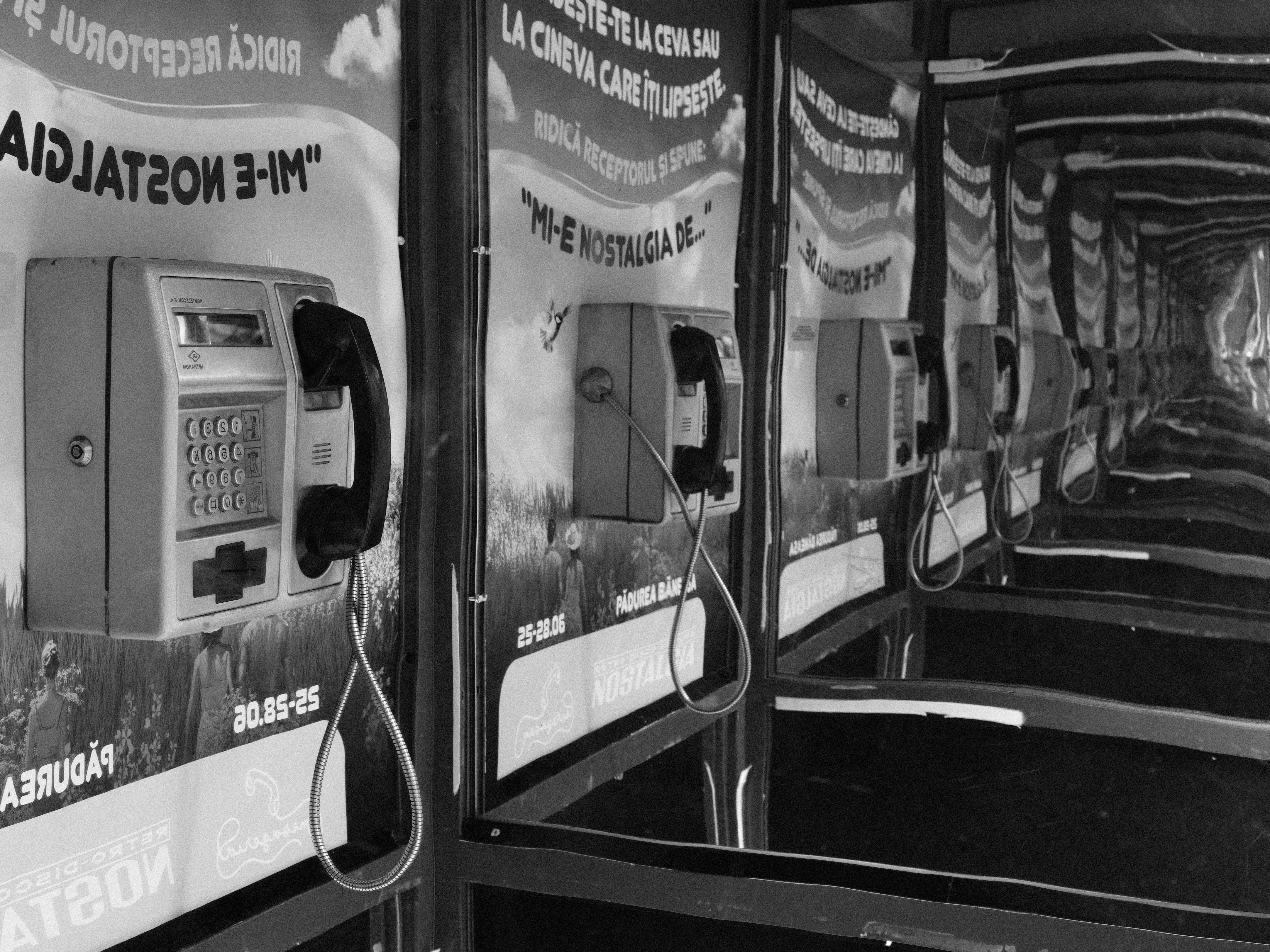 Coin-operated kiosks line a dim corridor inside a bus interior