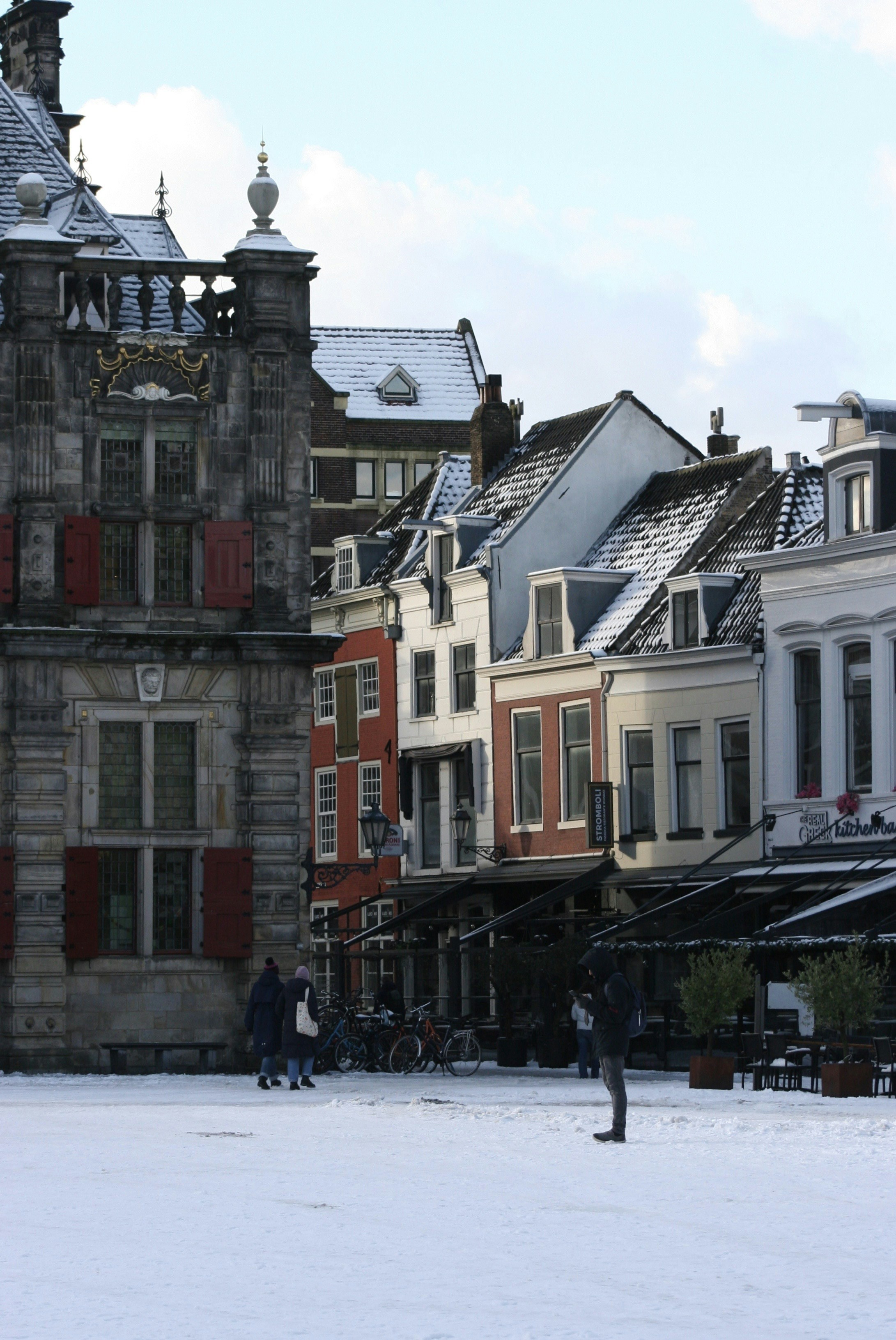 Snowy Courtyard Under Historic Gables