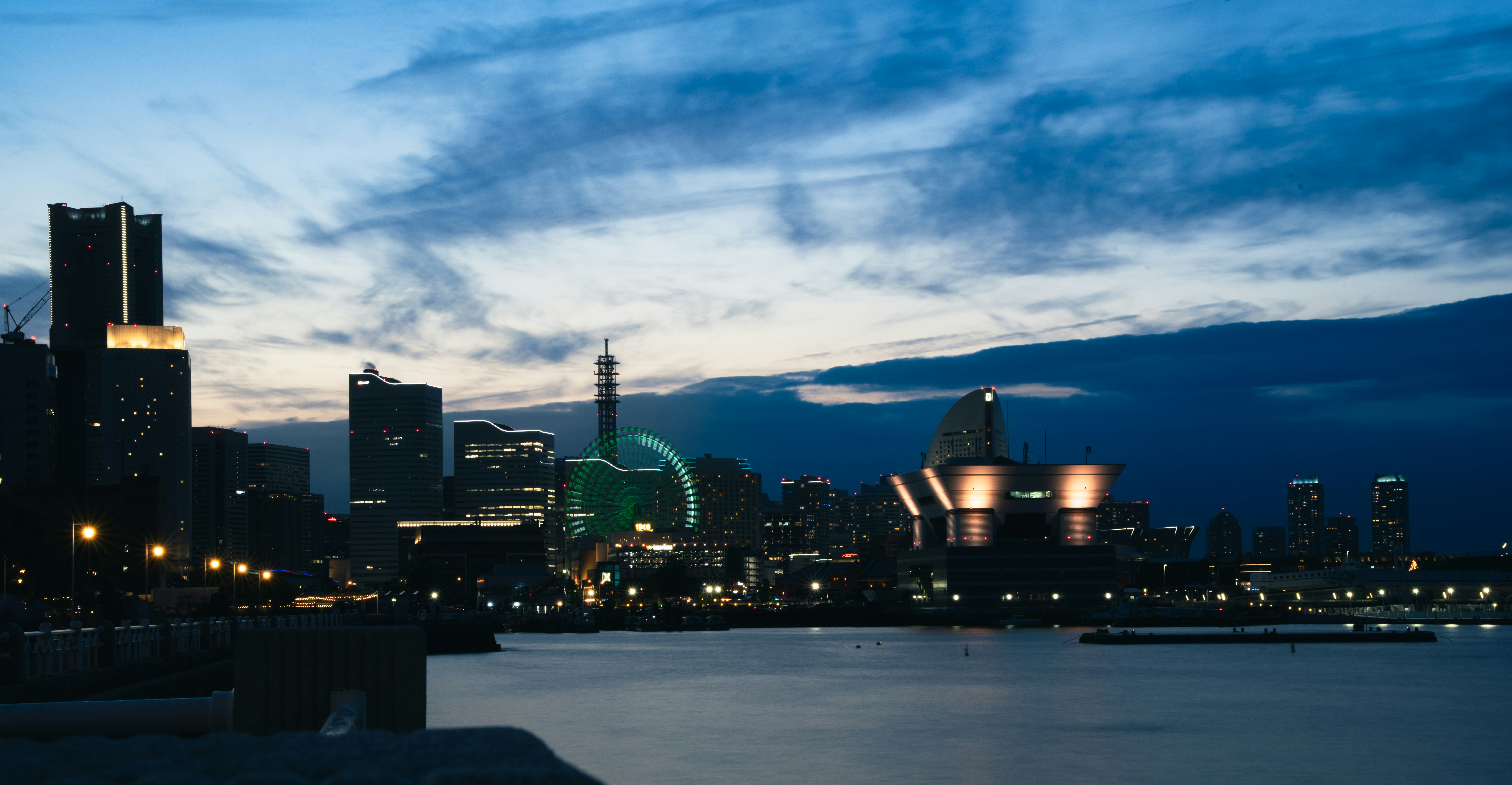 City Lights on the River: Twilight Skyline Over the Waterfront